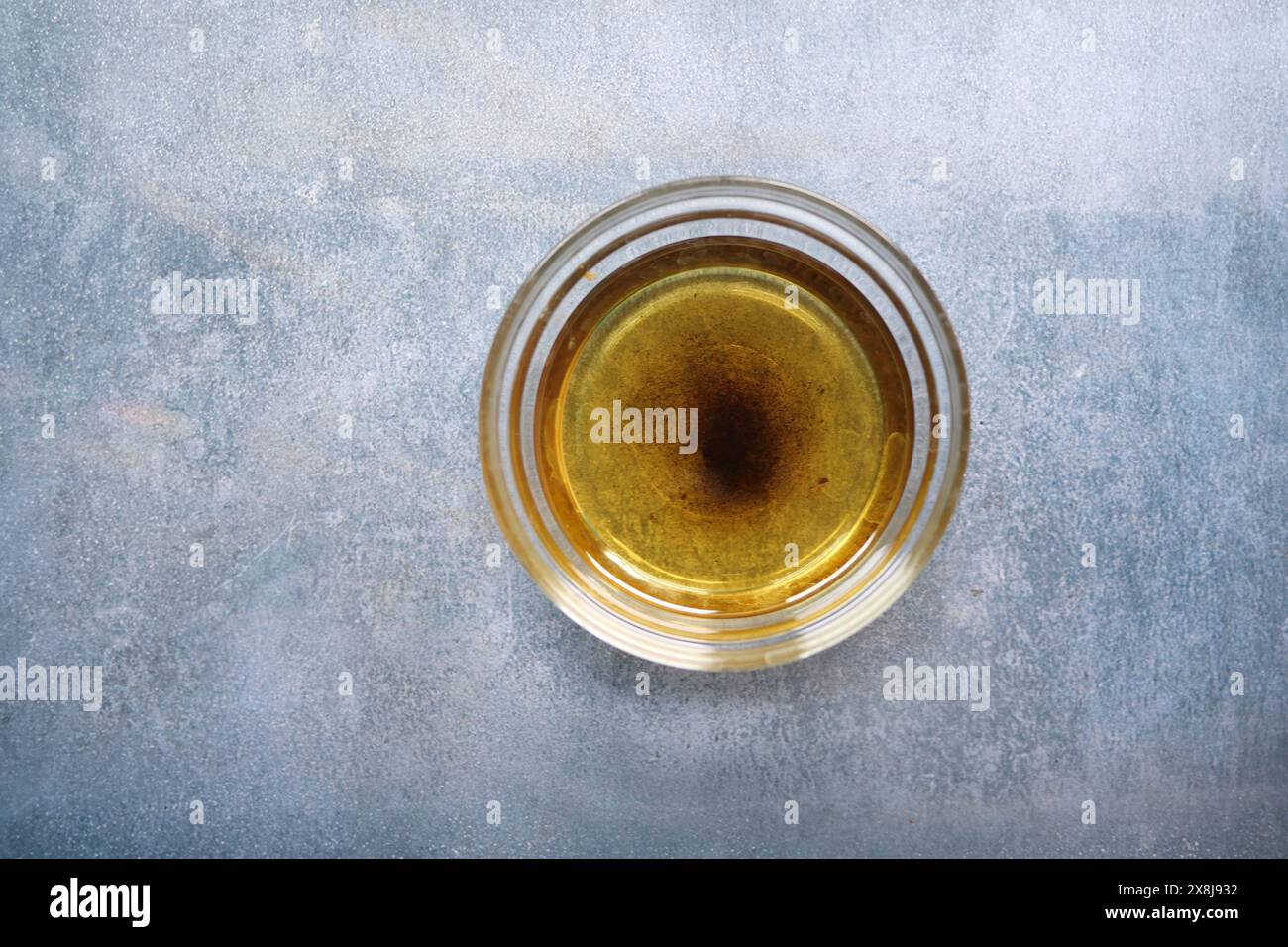 used cooking oil in small bowl Stock Photo - Alamy