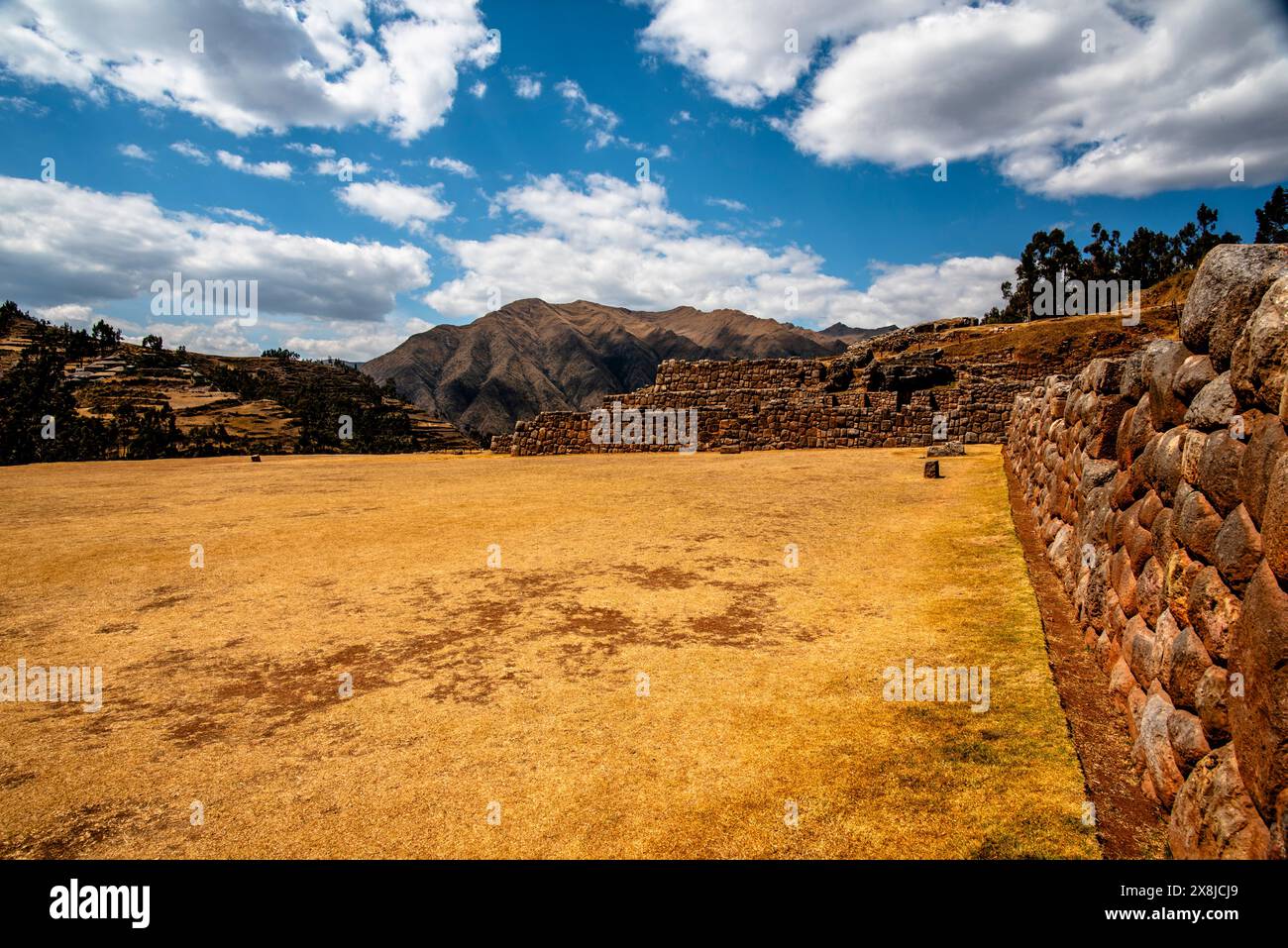 ruins of carved stone Inca citadel built among the mountain peaks of ...
