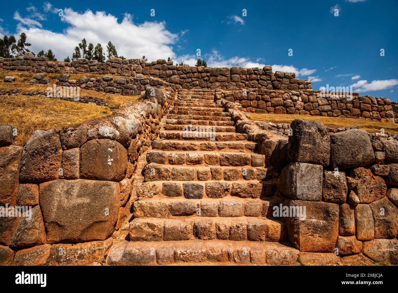 ruins of carved stone Inca citadel built among the mountain peaks of ...