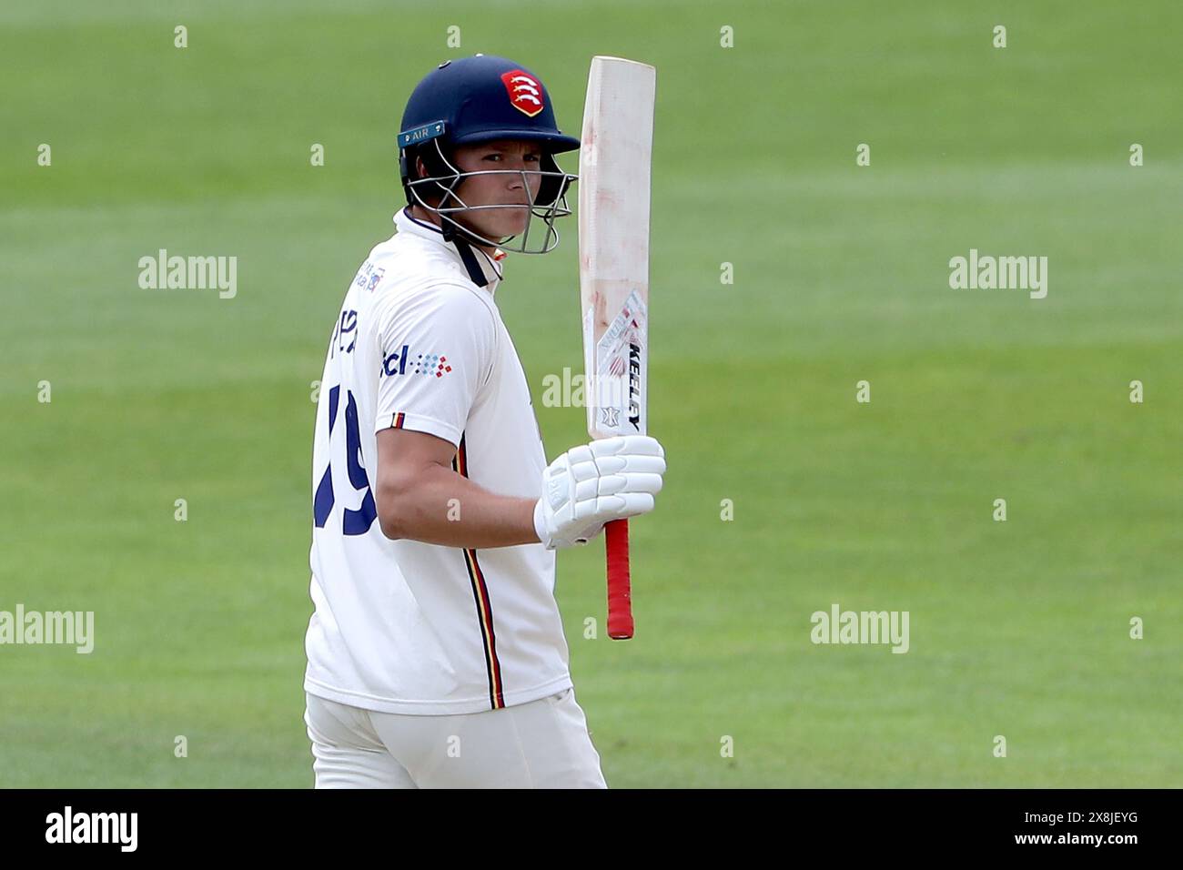 Michael Pepper of Essex raises his bat to celebrate reaching his fifty ...