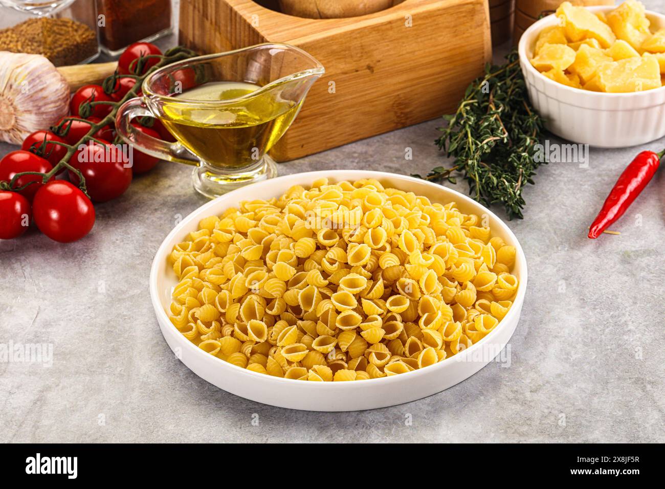Italian cuisine - dry conchiglie shell pasta Stock Photo - Alamy