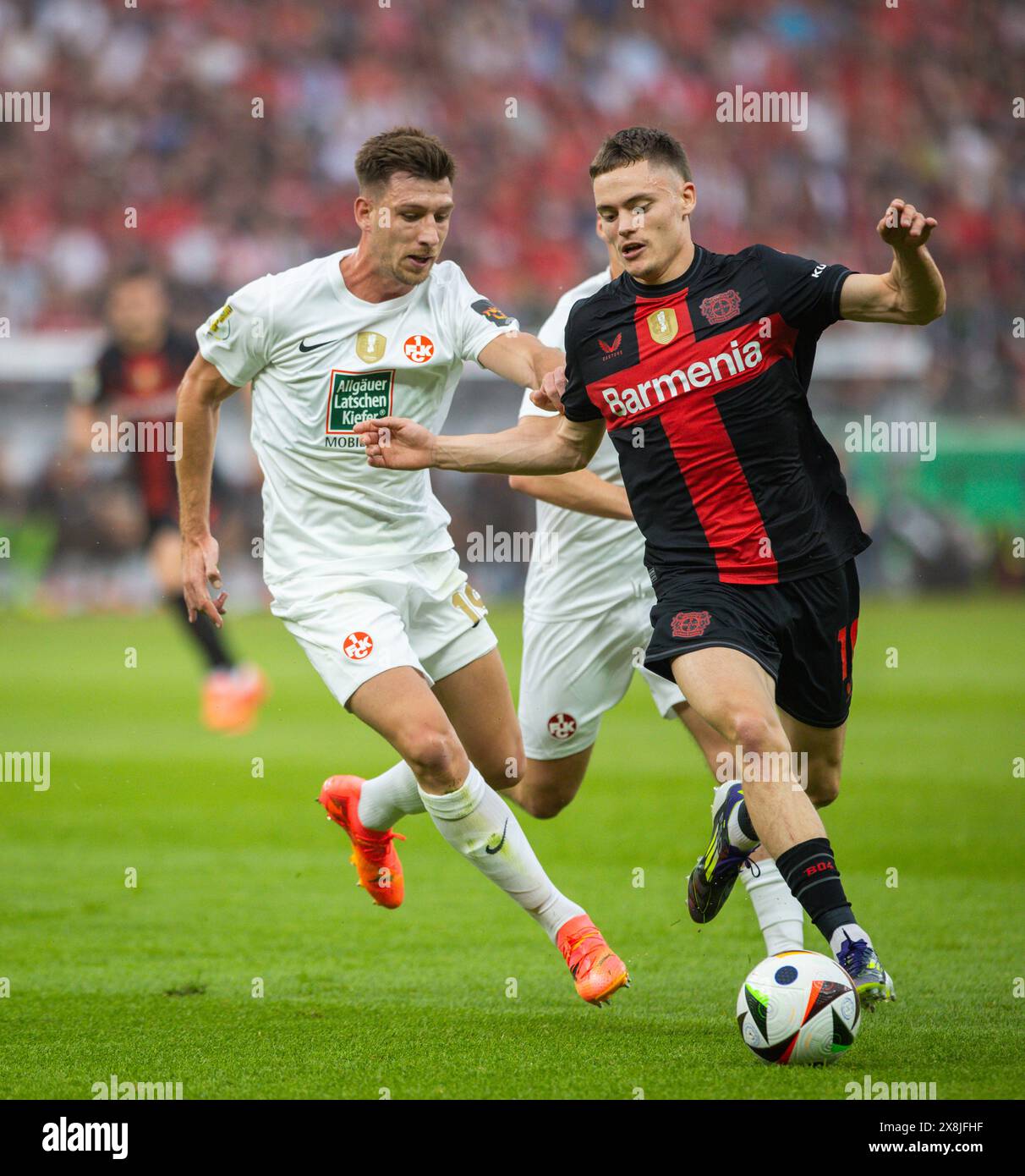 Berlin, Germany. 25th Mai 2024. Florian Wirtz (Leverkusen) Daniel Hanslik (FCK) 1. FC ...