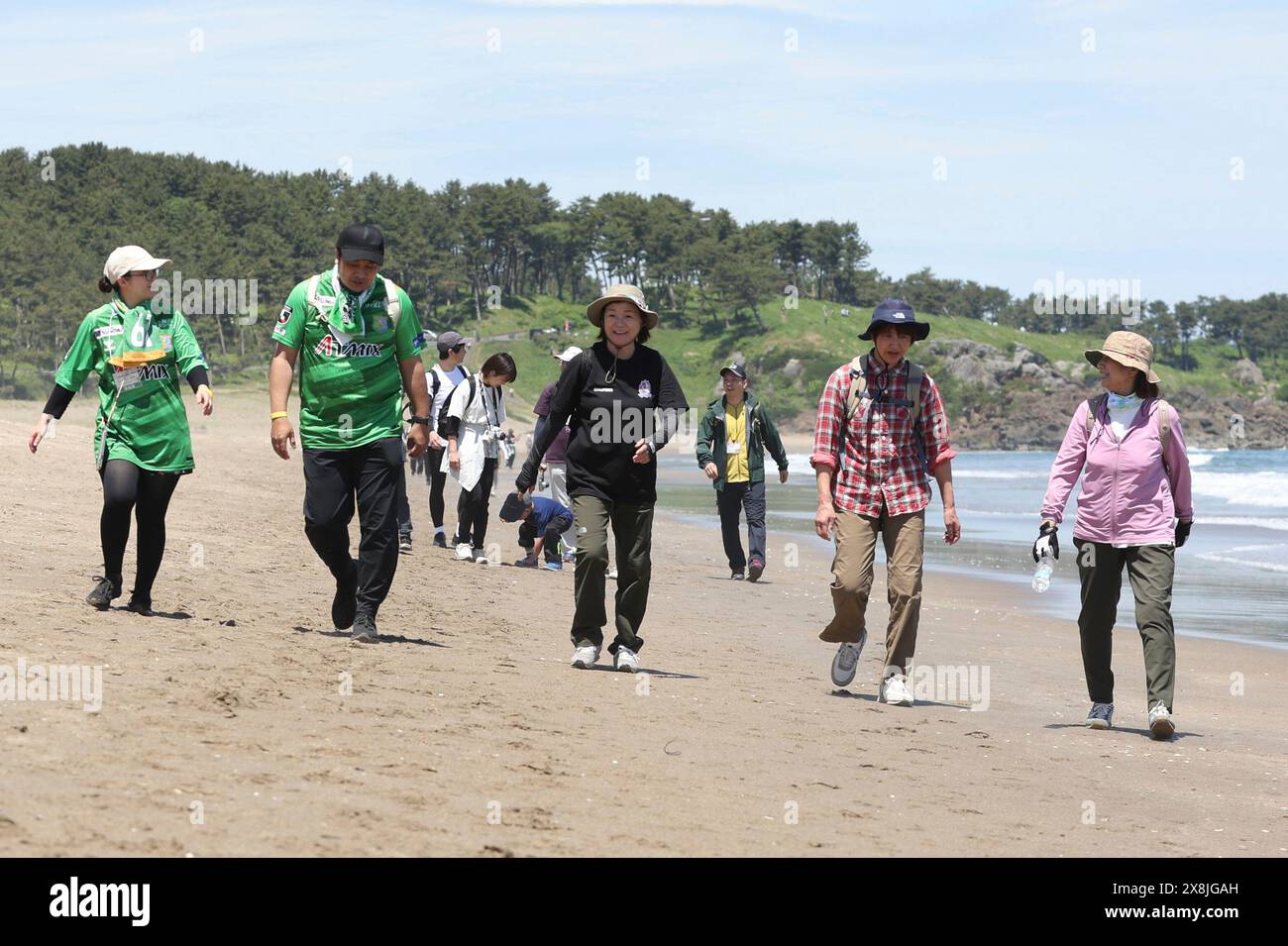 Participants walk during an event Michikoku Coastal Trail Walk in Hachinohe City, Aomori ...
