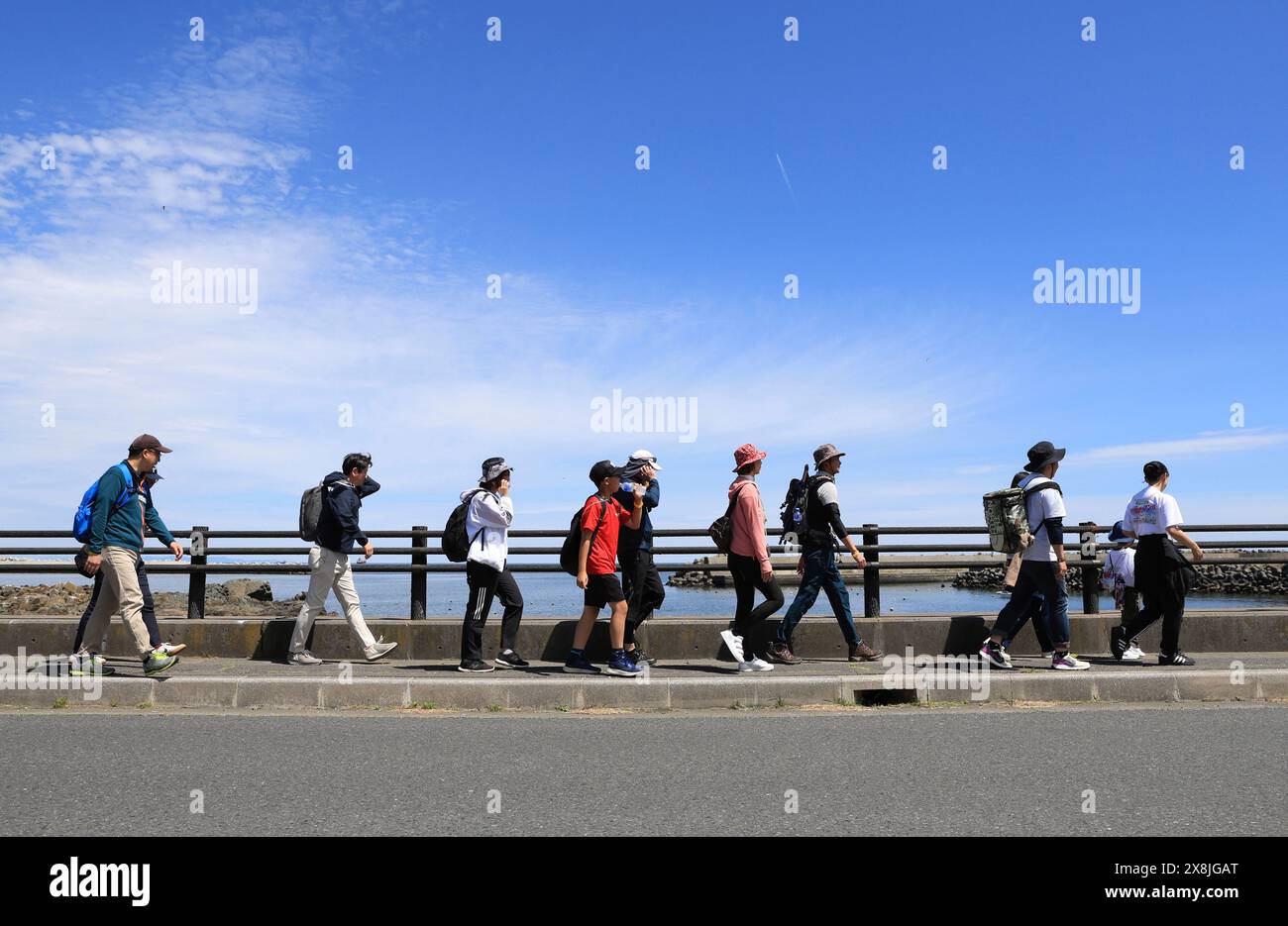 Participants walk during an event Michikoku Coastal Trail Walk in Hachinohe City, Aomori ...