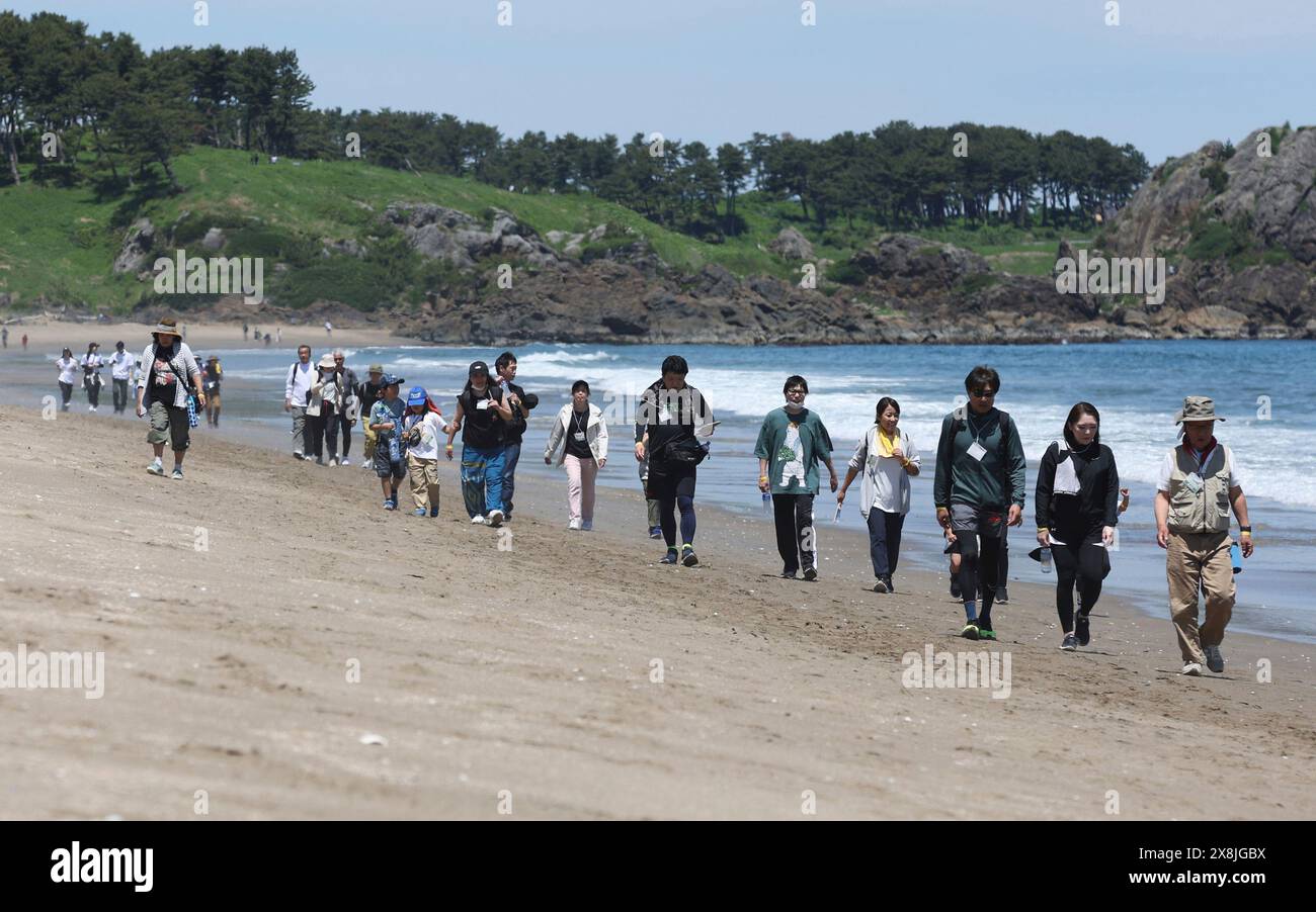 Participants walk during an event Michikoku Coastal Trail Walk in Hachinohe City, Aomori ...