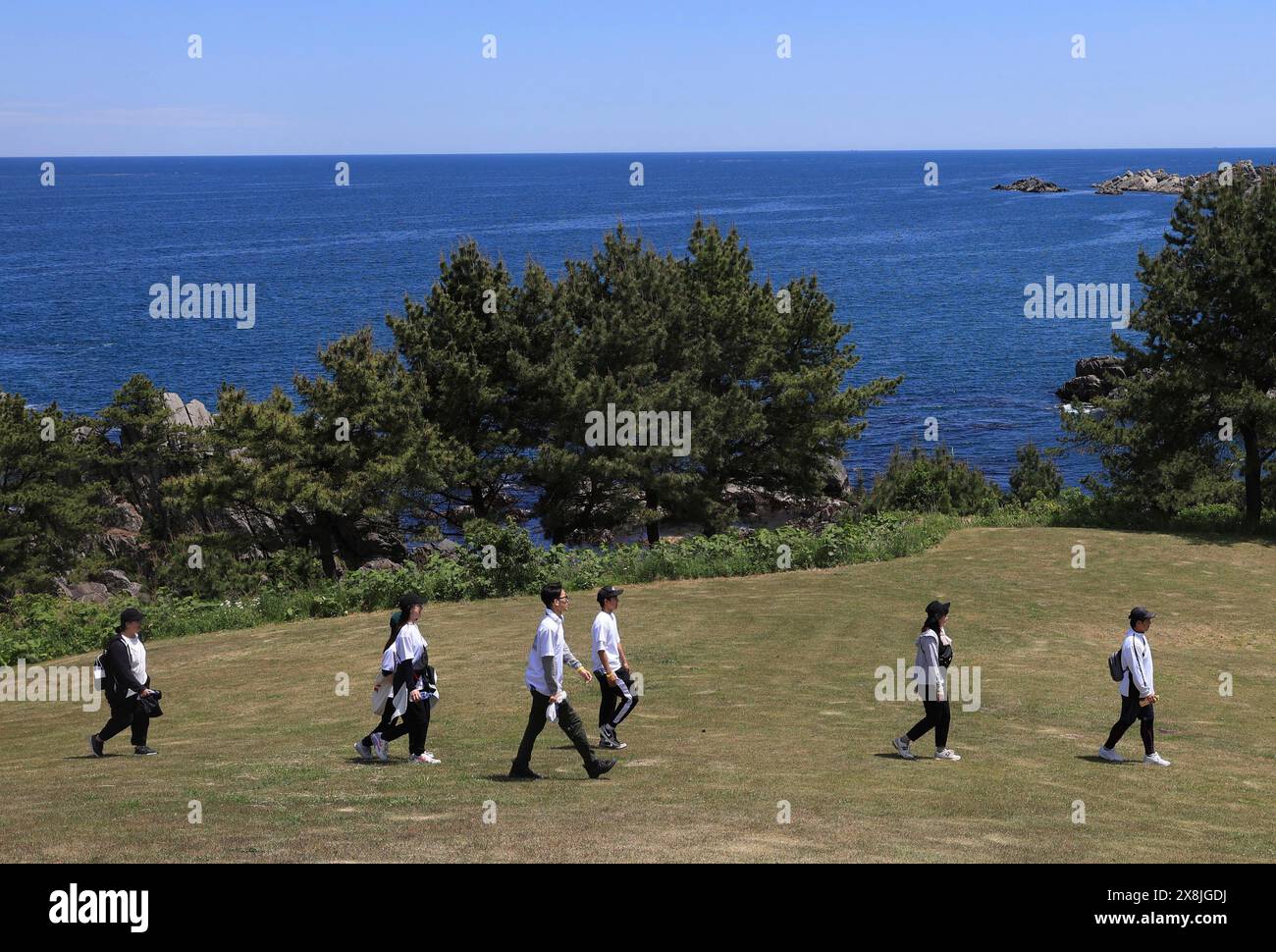 Participants walk during an event Michikoku Coastal Trail Walk in Hachinohe City, Aomori ...