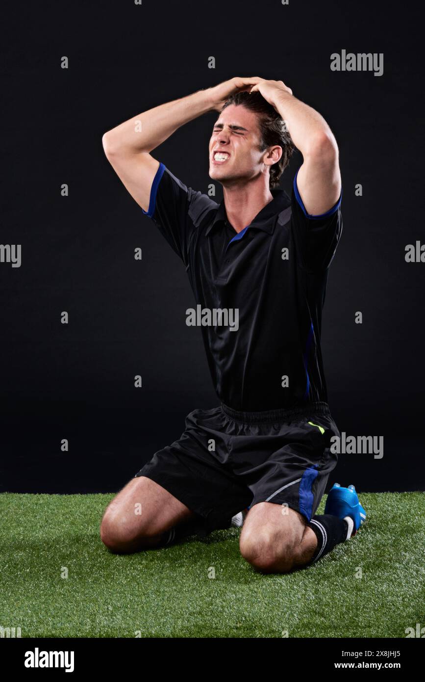 Field, soccer player and man in grass, frustrated and fail in game ...