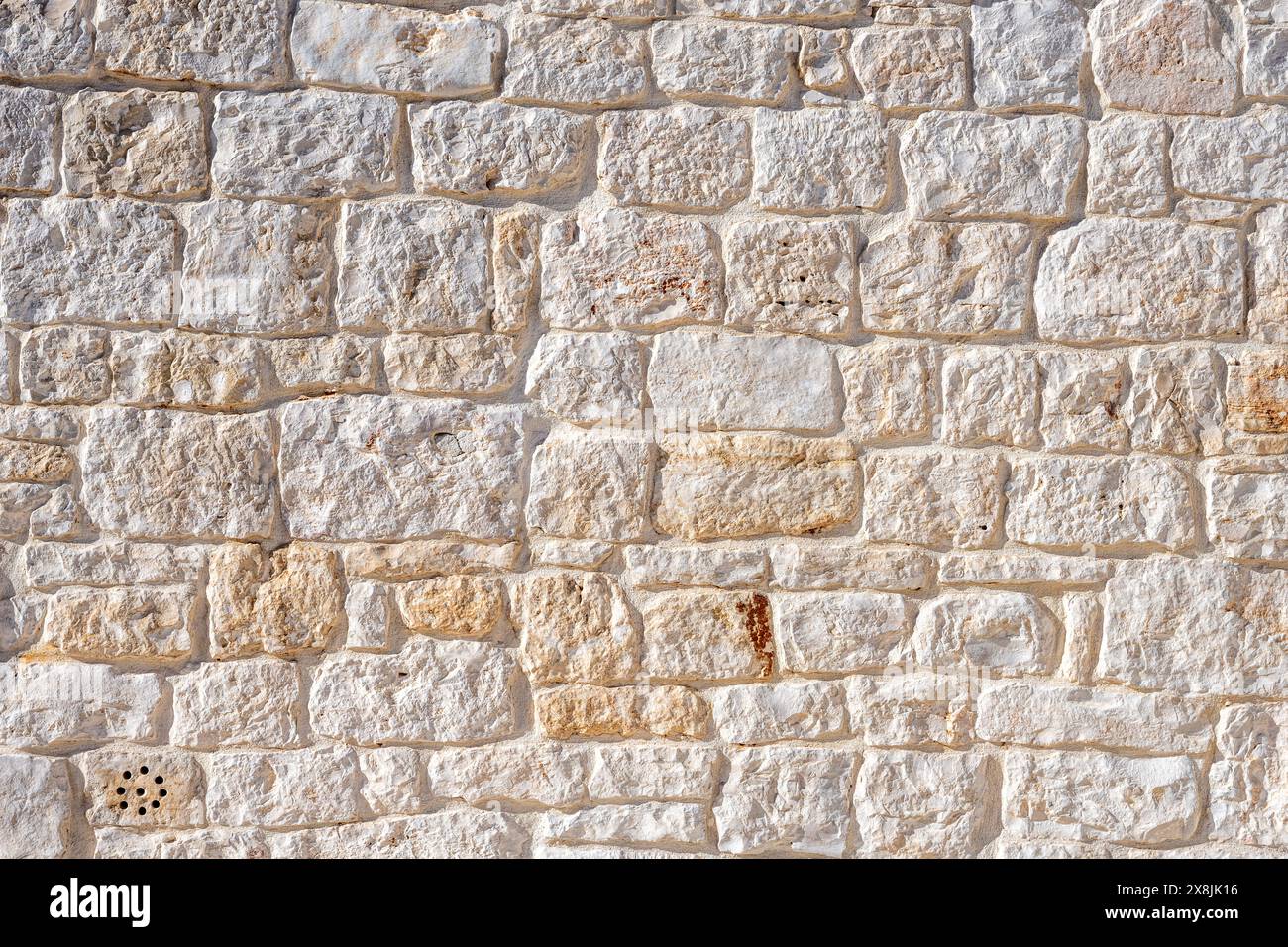 Background from an old natural stone wall seen in Italy Stock Photo - Alamy