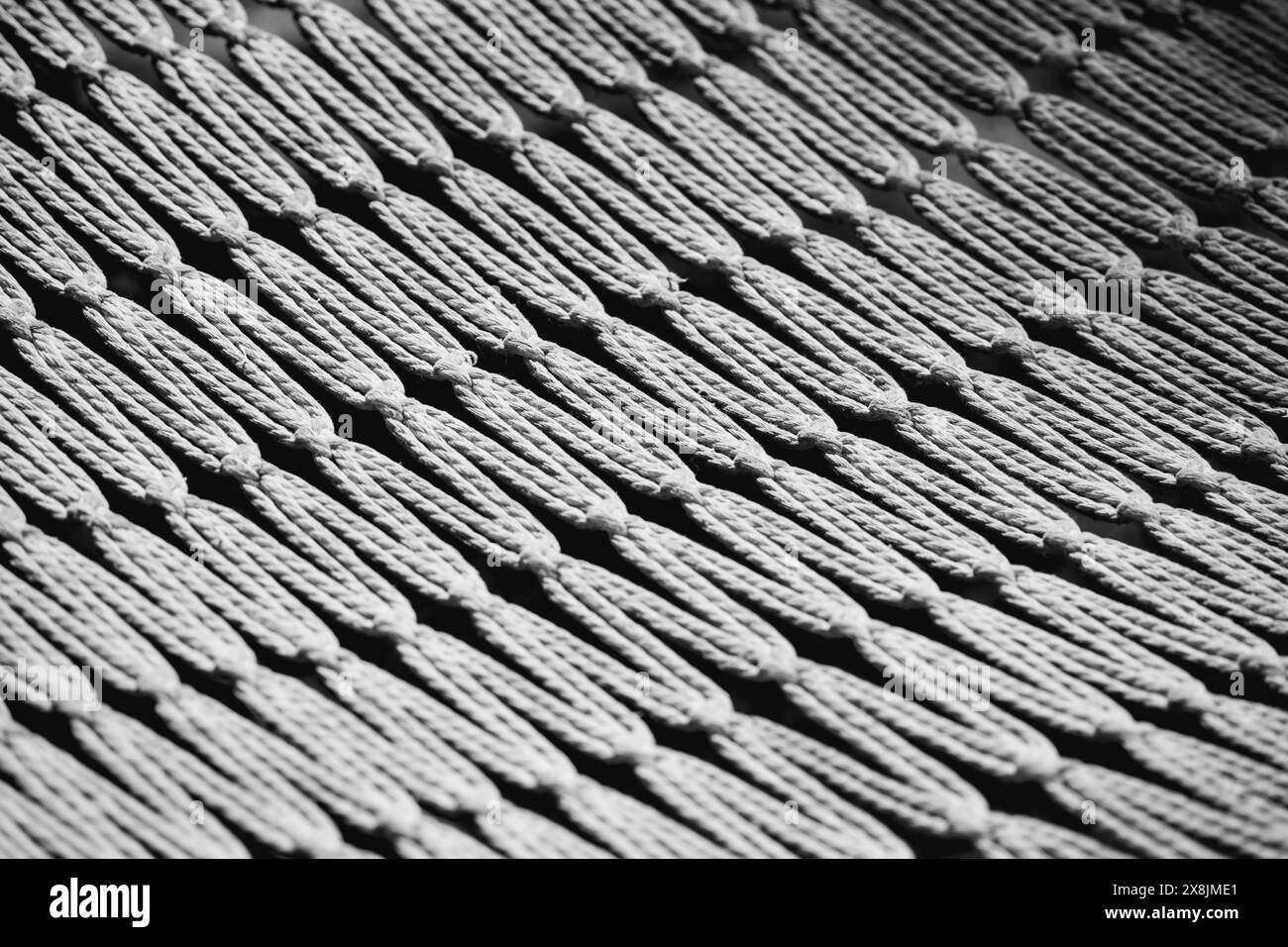 A detailed view of a knitted textile featuring a geometric design Stock ...