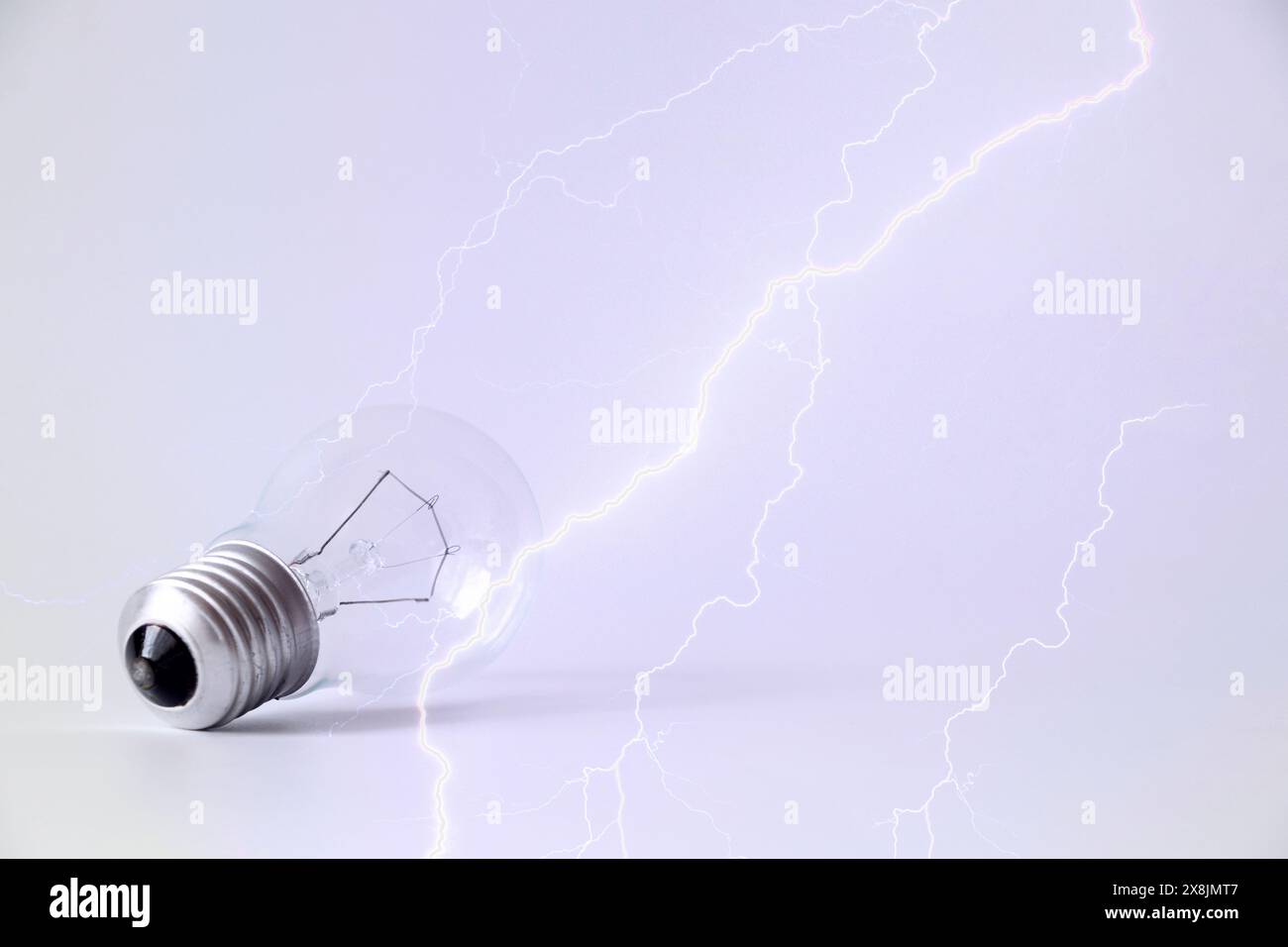 Incandescent lamp and lightning on isolated background, light and ...