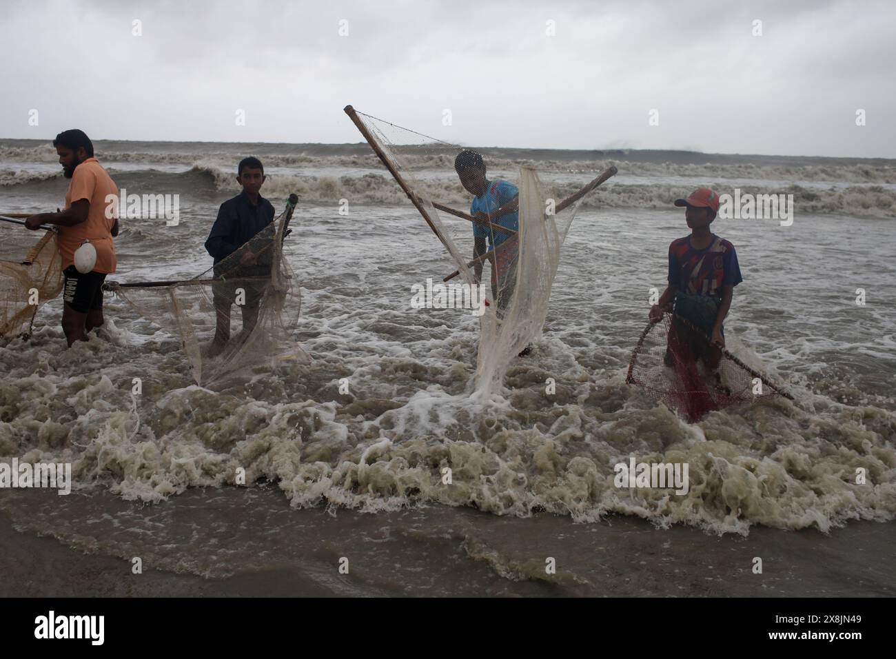 Dhaka, Dhaka, Bangladesh. 26th May, 2024. local people are fishing at ...