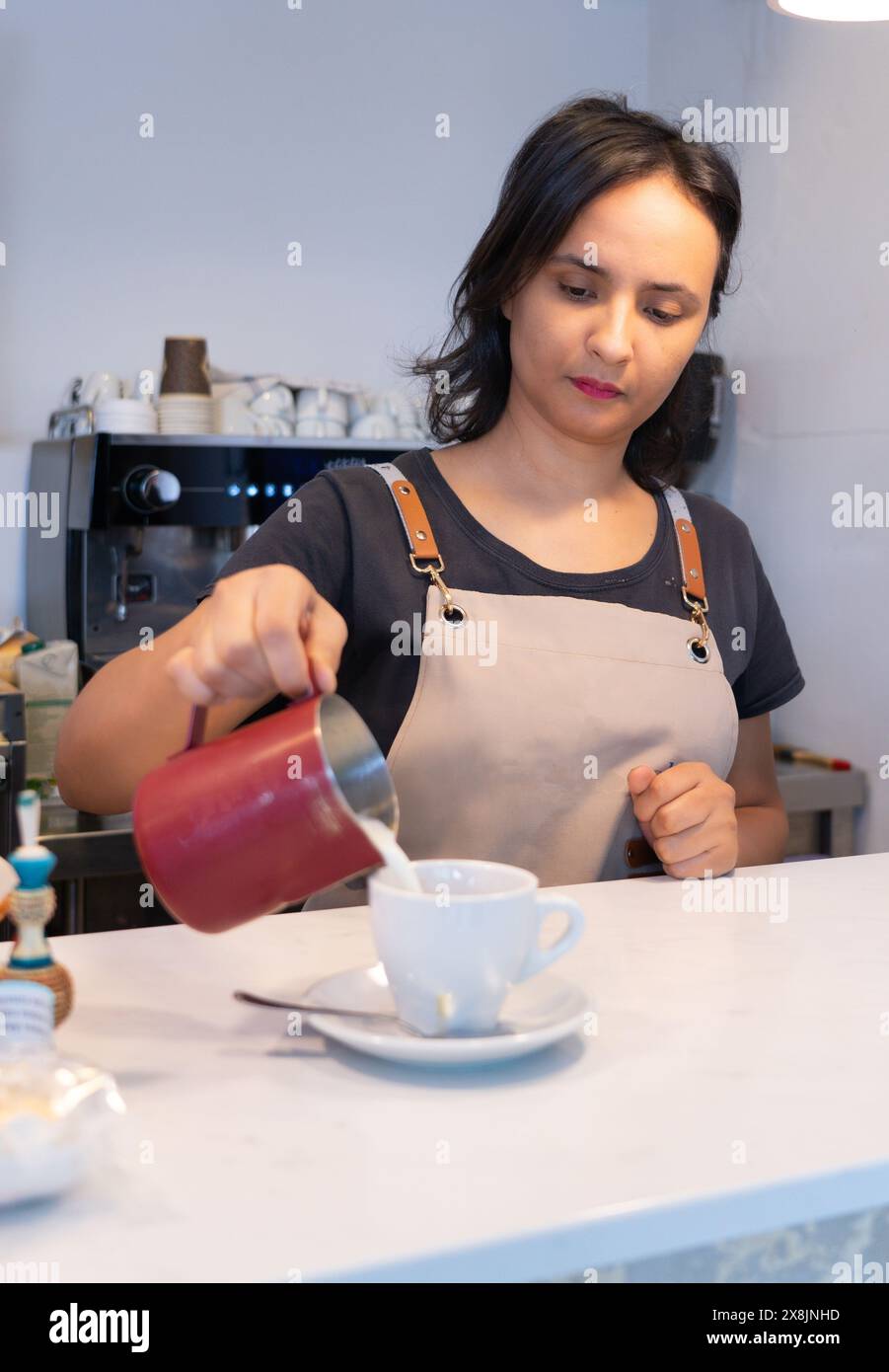Moroccan woman waitress serving a latte in a cafe Stock Photo - Alamy