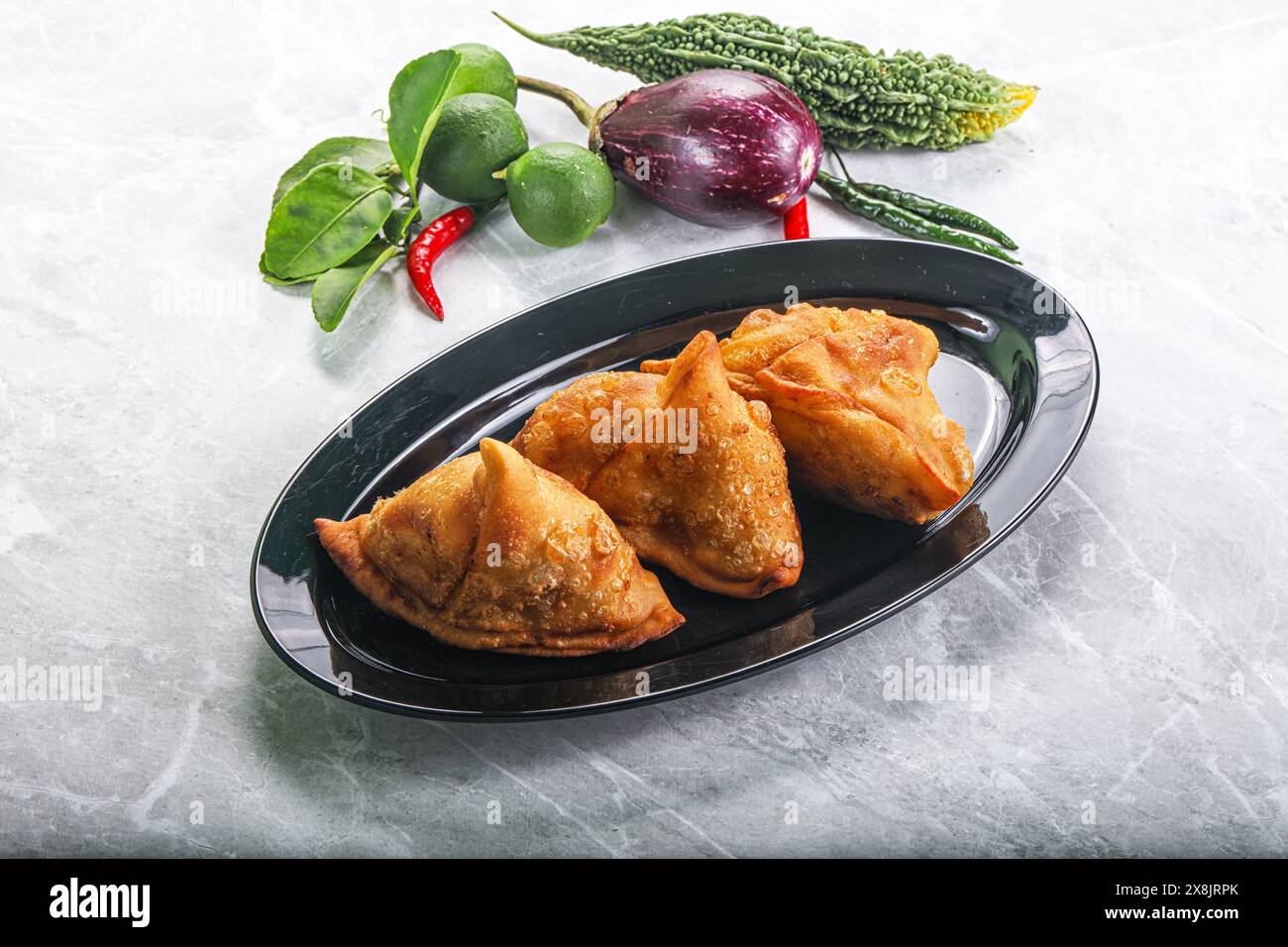 Indian cuisine - fries crispy stuffed samosa Stock Photo - Alamy