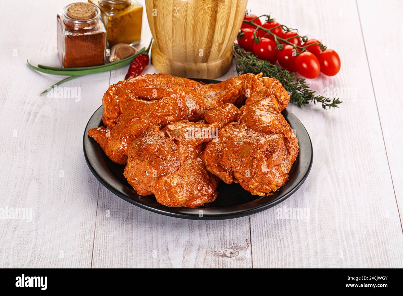 Raw turkey shoulder wing in Indian tandoori marinade spices Stock Photo ...