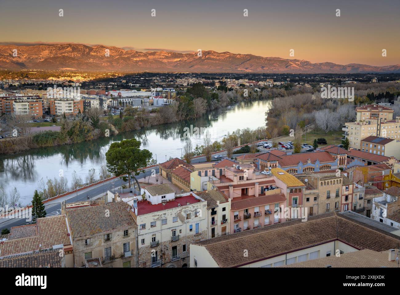 City of Tortosa and Ebro river in a sunrise. In the background, the ...