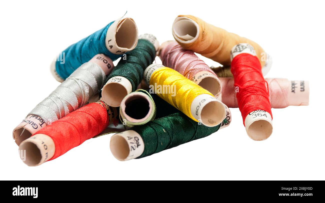spools of colored yarn stacked on a white or transparent isolated ...