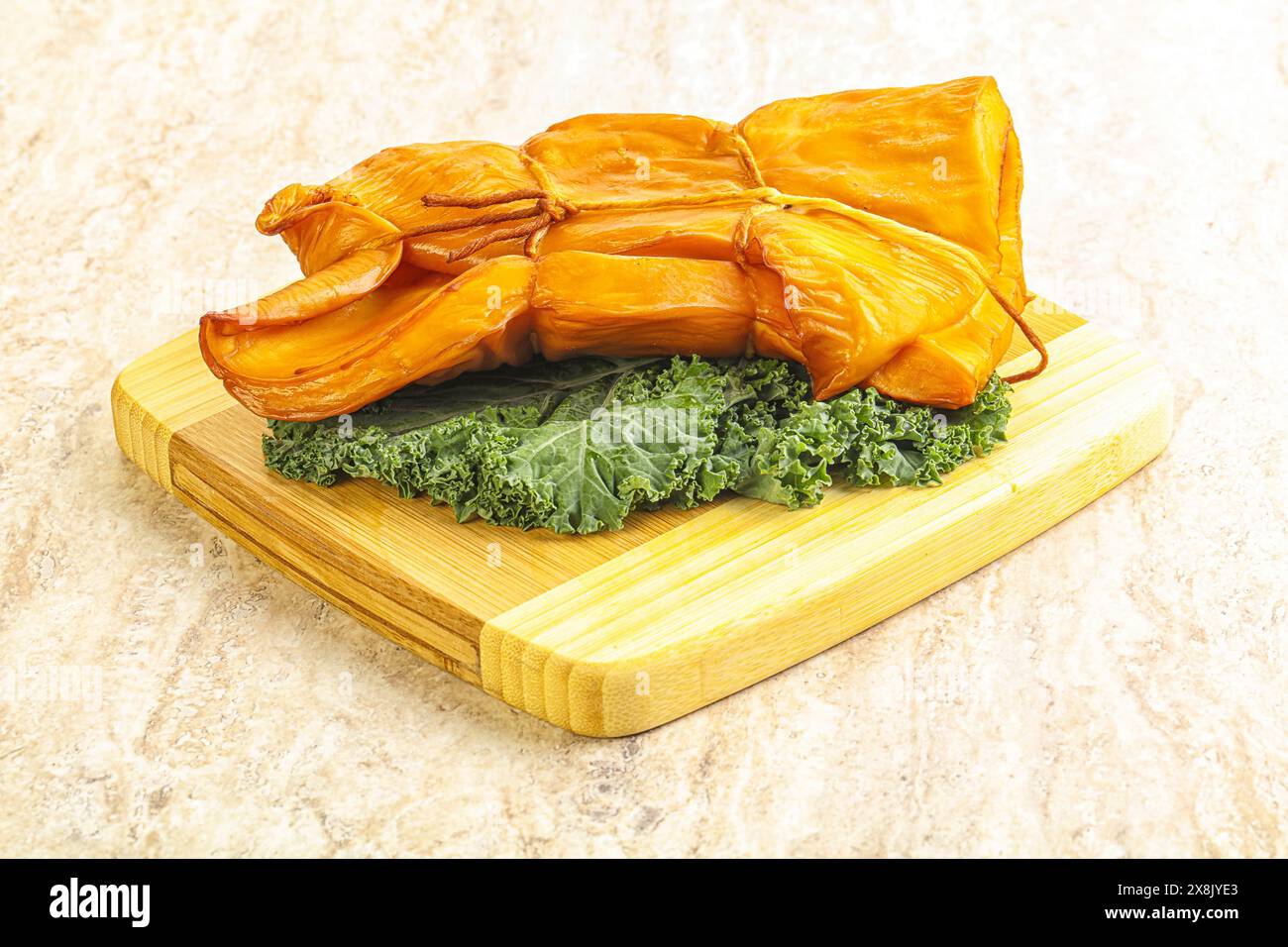 Smoked squid calamar appetizer snack isolated Stock Photo - Alamy