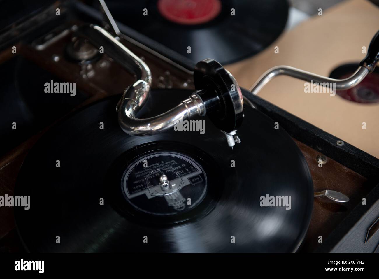 Old vintage turntable vinyl record player with disc spinning and ...