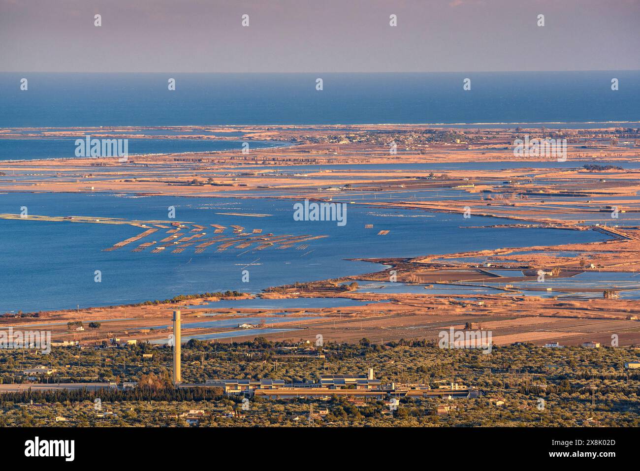 The Fangar bay and point seen from the Baix Ebre wind farm at sunset ...