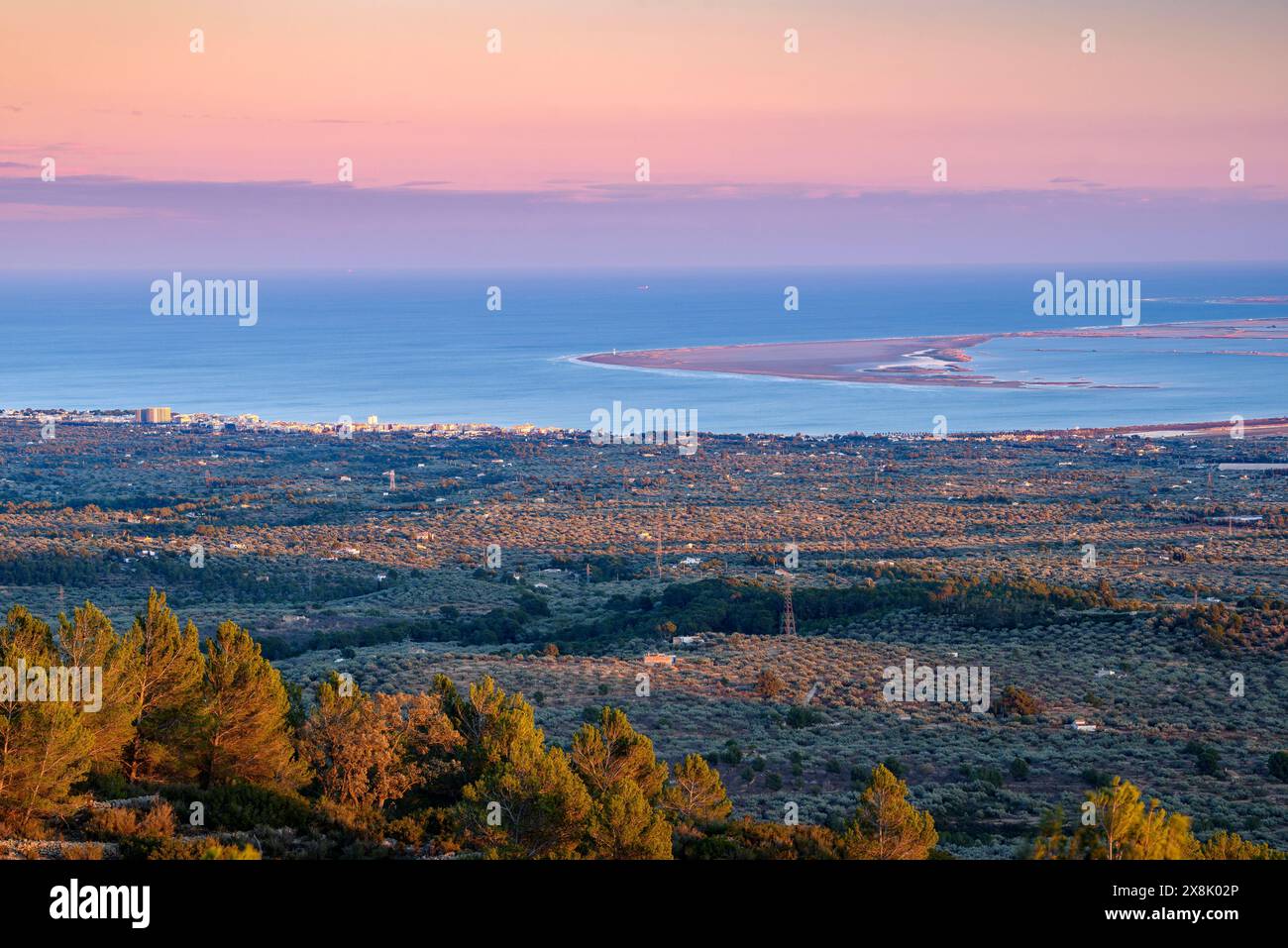 The Fangar bay and point seen from the Baix Ebre wind farm at sunset ...