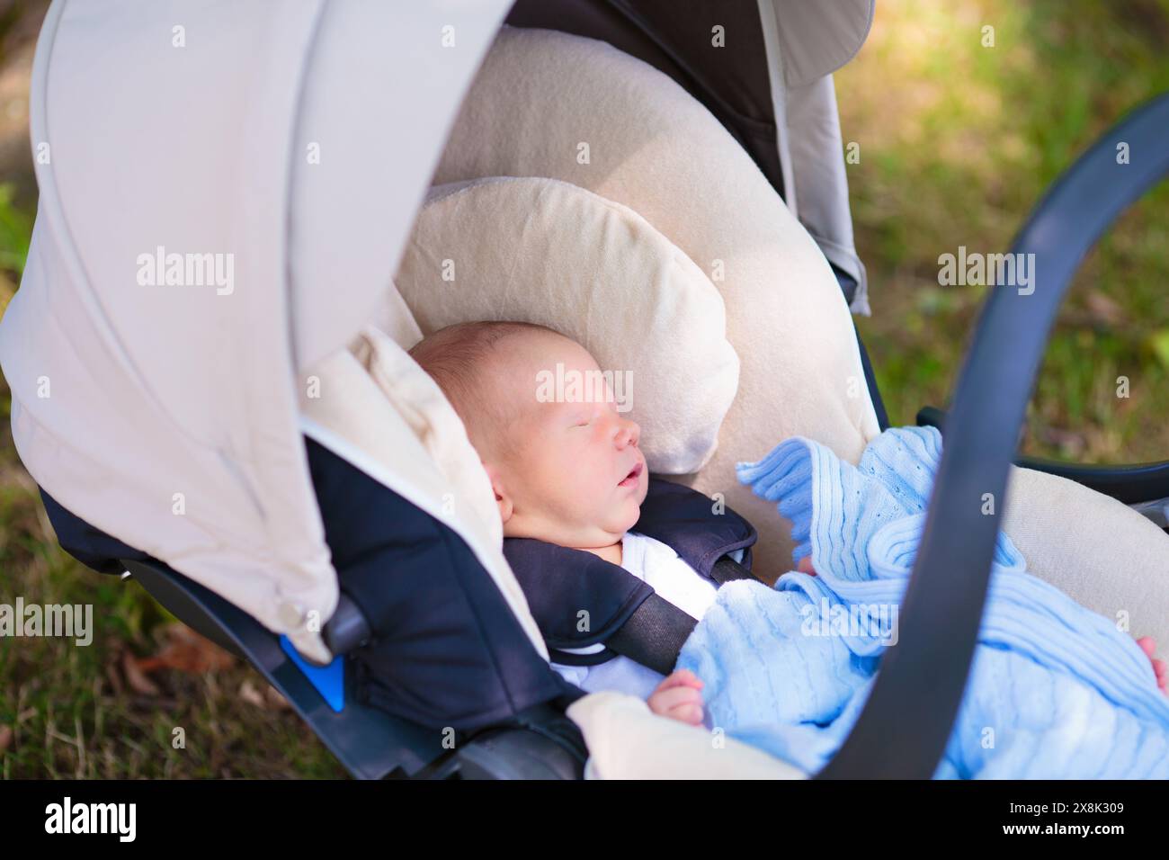 Newborn baby in car seat. Safe transportation of infant after hospital ...