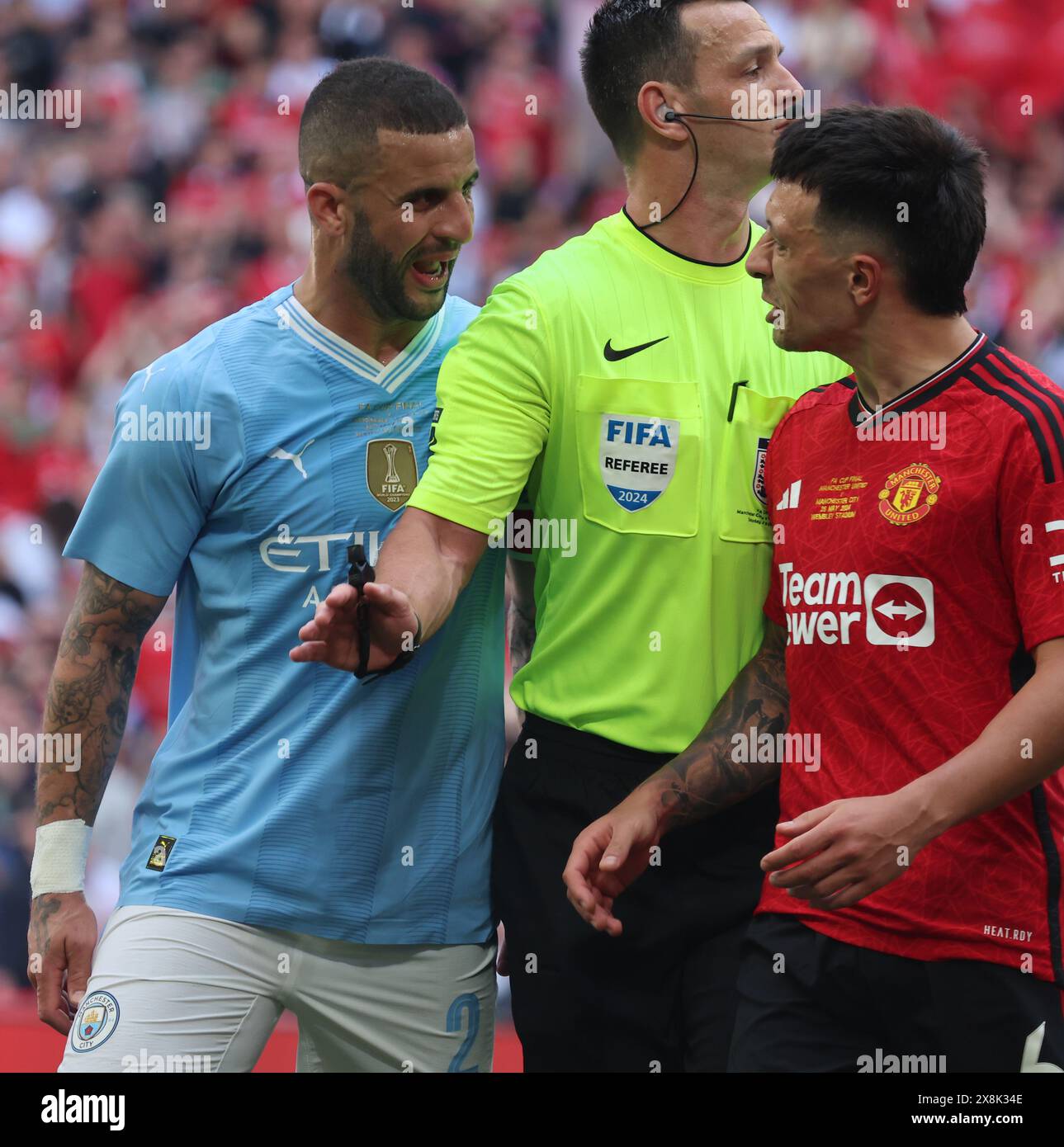 London, UK. 25th May, 2024. LONDON, ENGLAND - L-R Manchester City's Kyle Walker having words ...