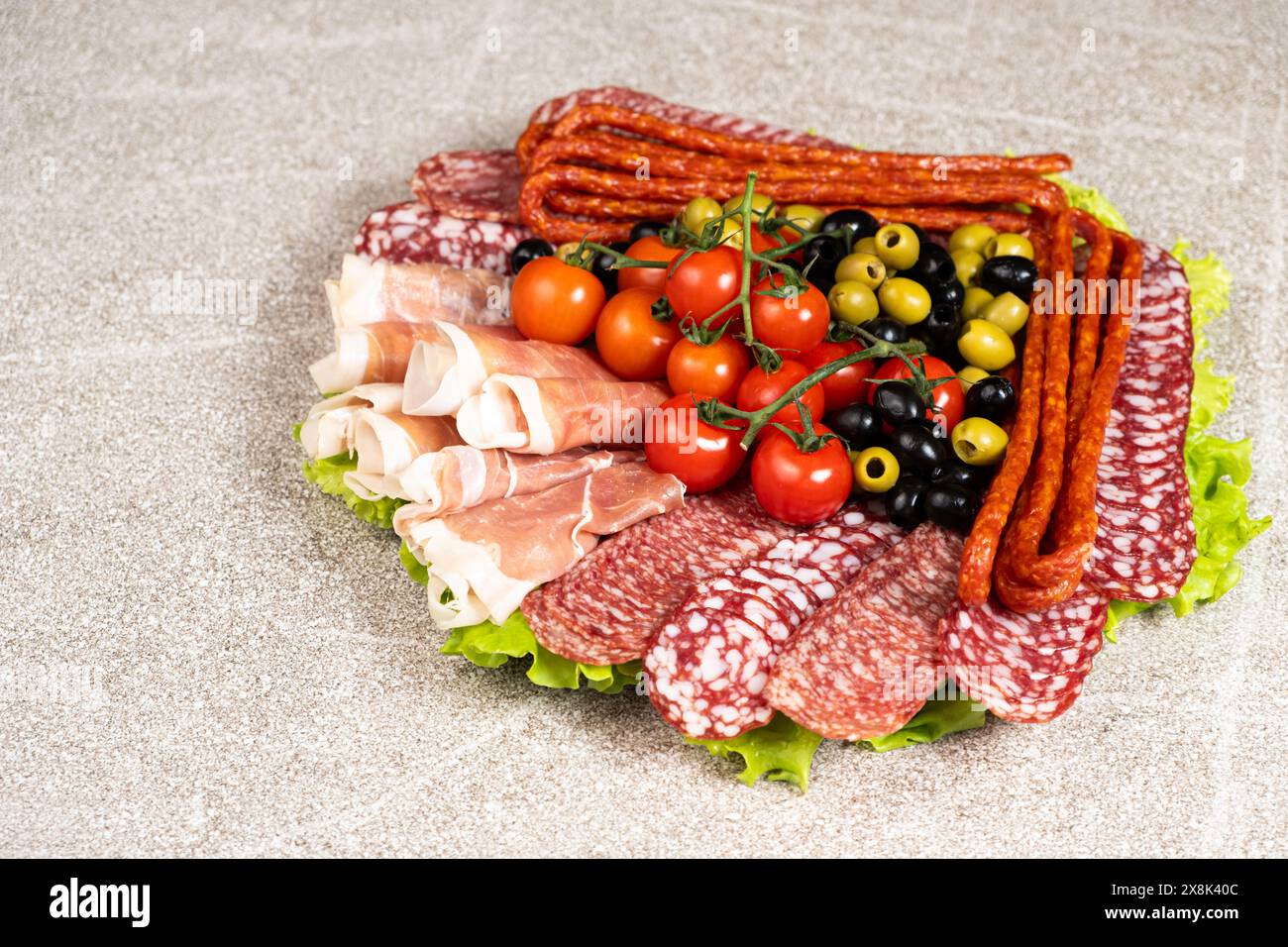 Beautiful serving of sausage sliced meat delicacies Stock Photo - Alamy