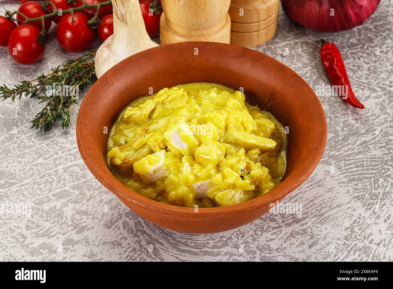 Italian cuisine - yellow risotto with chicken and soft cheese Stock ...