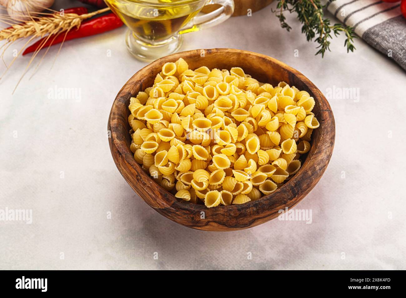 Italian cuisine - dry conchiglie shell pasta Stock Photo - Alamy