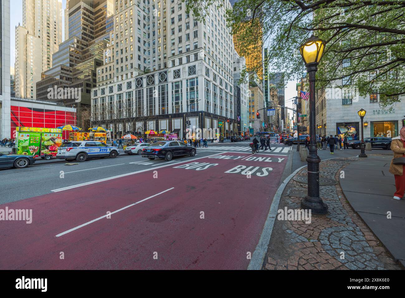 Gorgeous view of Fifth Avenue with pedestrians, traffic flow, and a ...