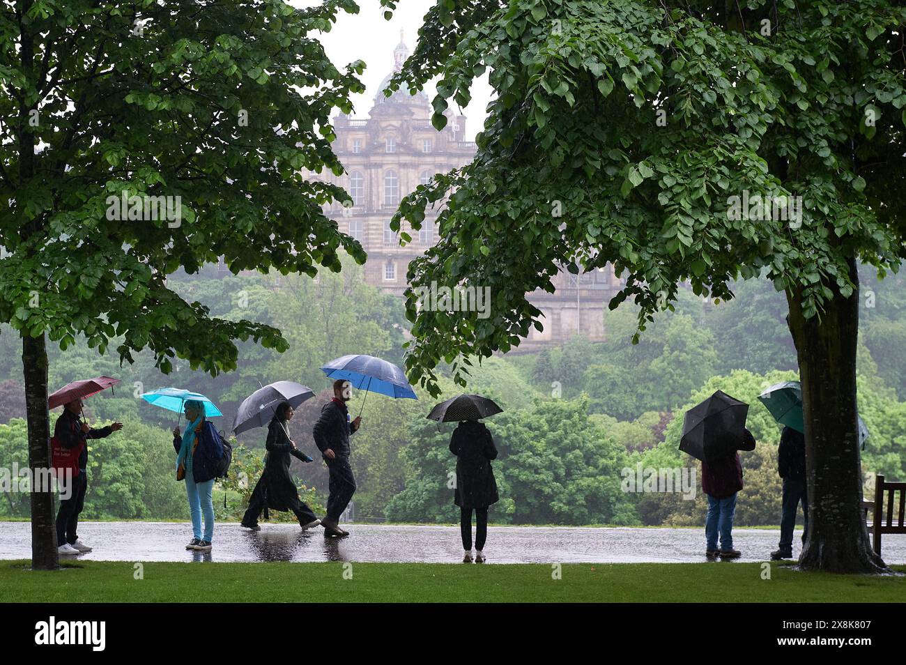 Edinburgh Scotland, UK 26 May 2024. WEATHER UK: People shelter from the ...