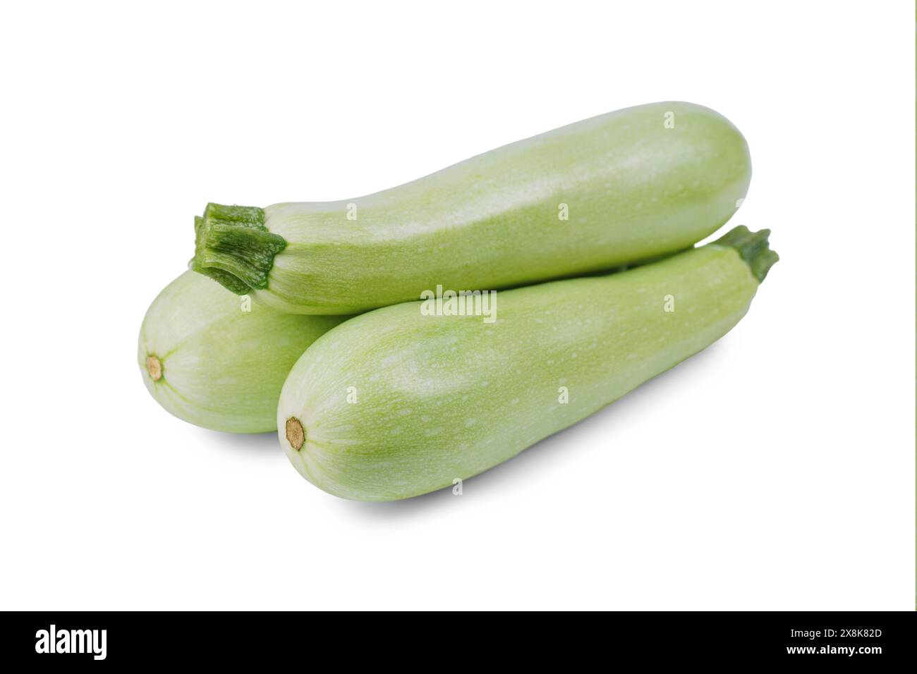 Fresh ripe green organic zucchini or courgettes isolated on white ...