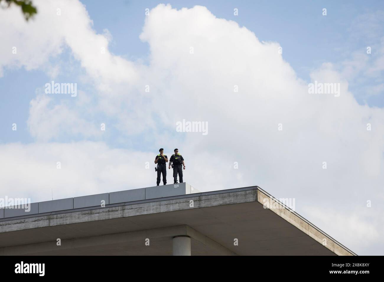 Two police officers observe the citizens' festival Celebrating ...
