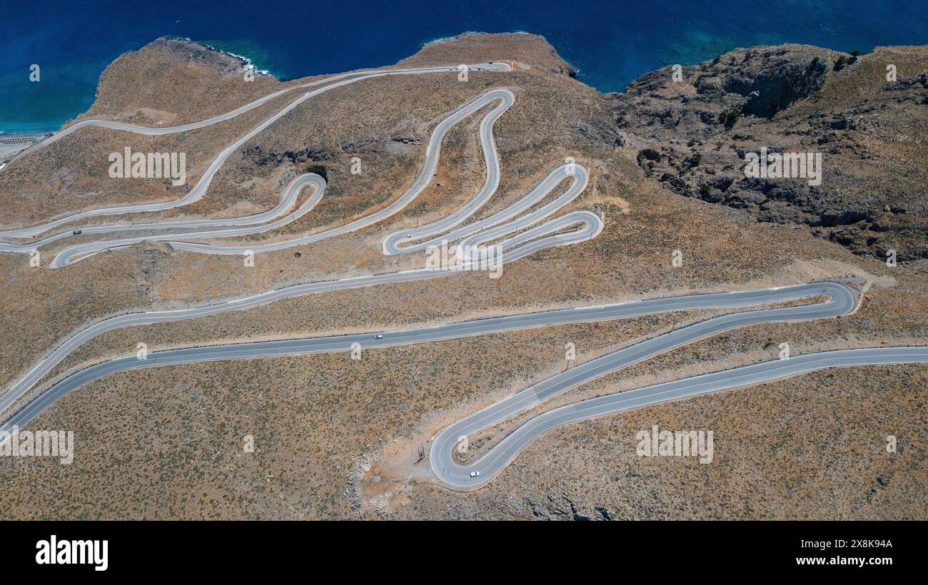 Aerial view of pass road serpentines from to Passo Anopoli above south ...