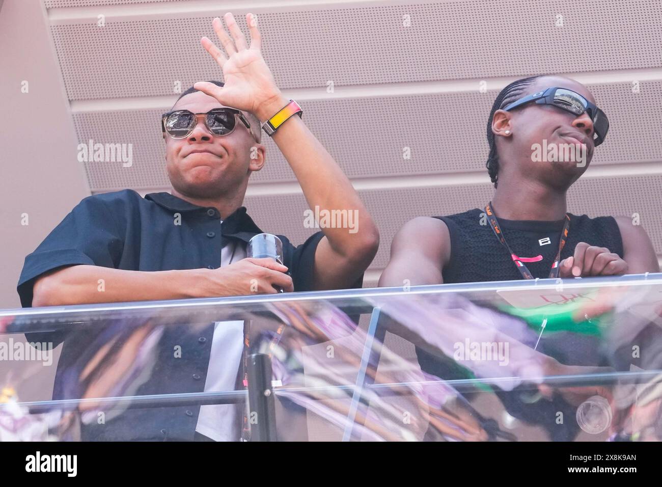 Kylian Mbappe, left, waves from a terrace before the Formula One Monaco ...