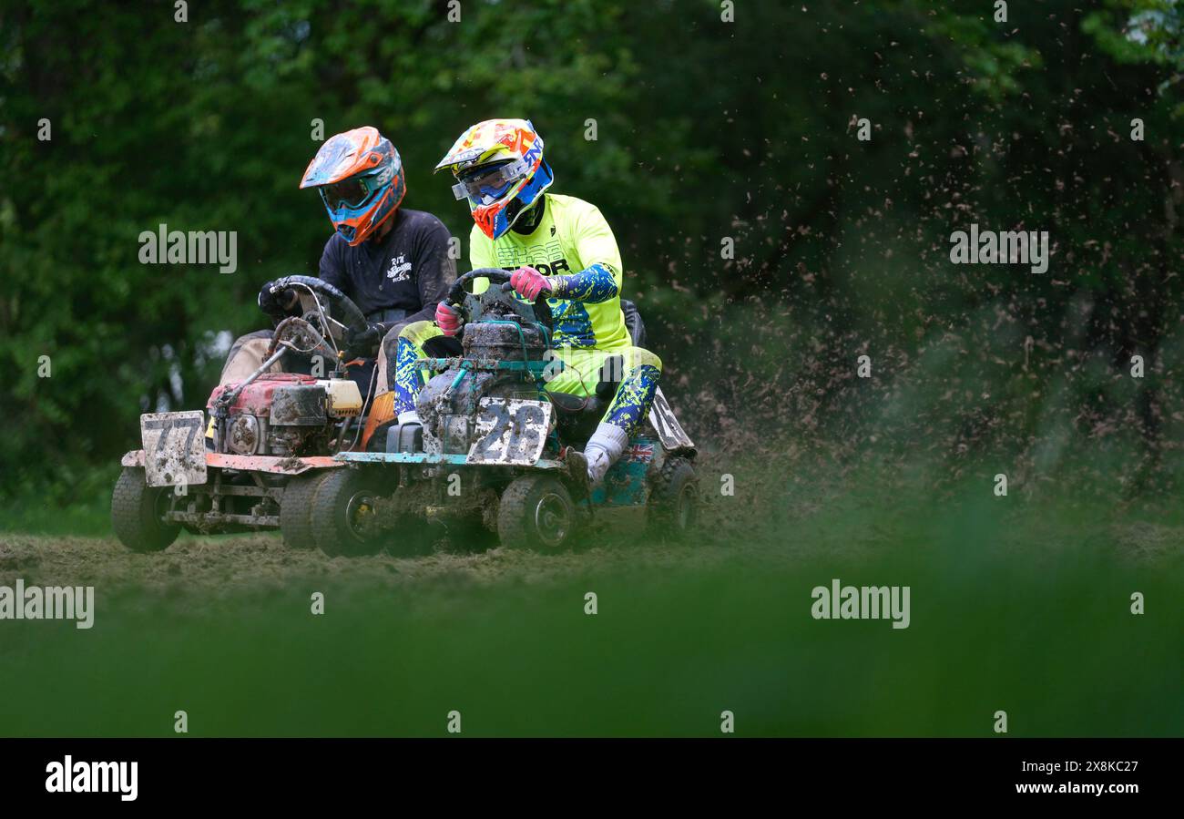 Competitors race in a heat during the World Lawnmower Championships ...