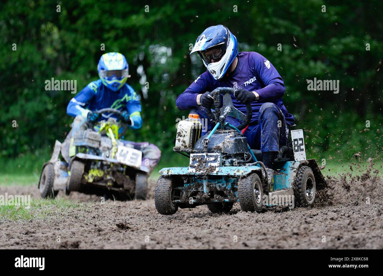 Competitors race in a heat during the World Lawnmower Championships ...