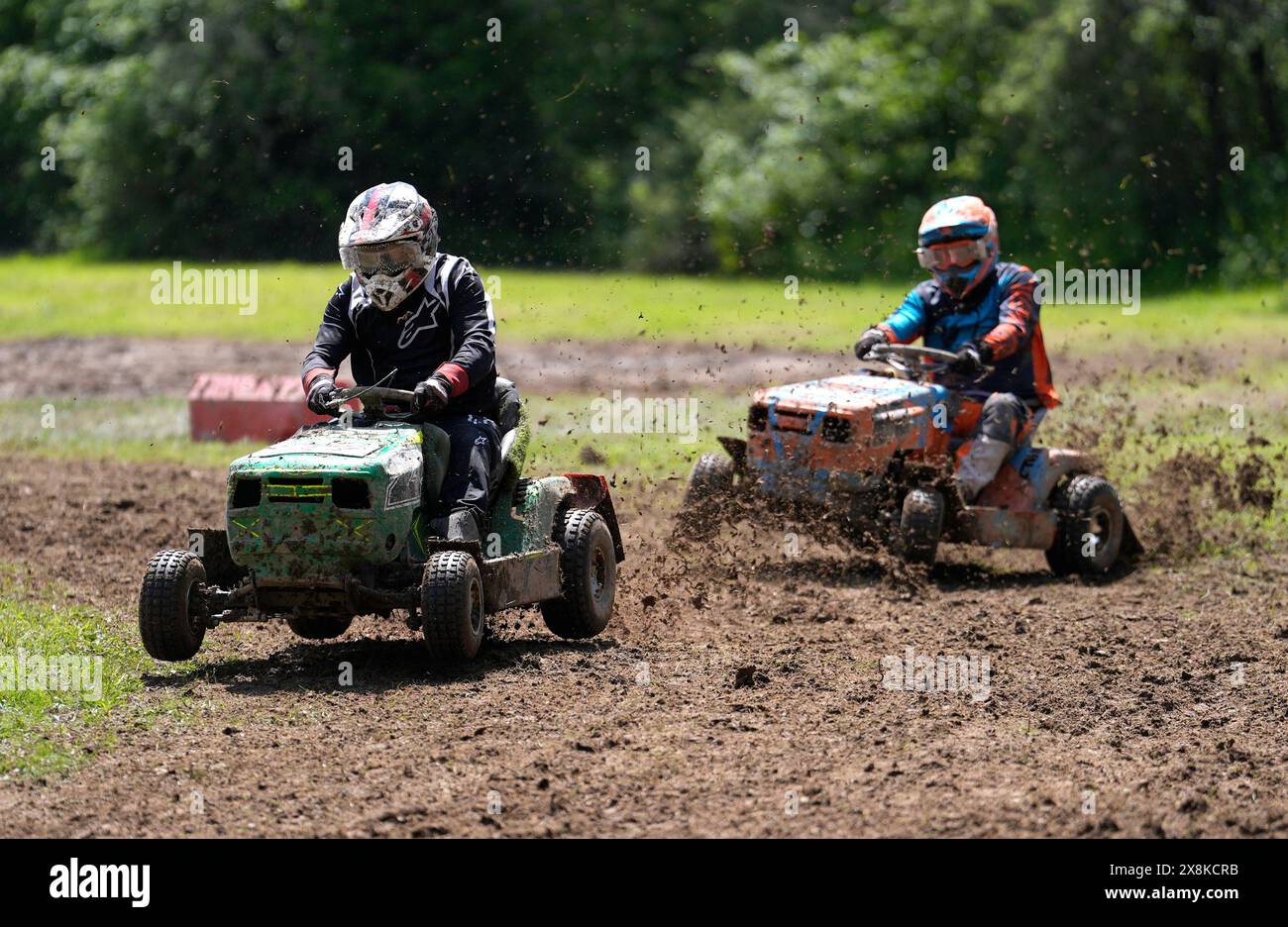 Competitors race in a heat during the World Lawnmower Championships ...