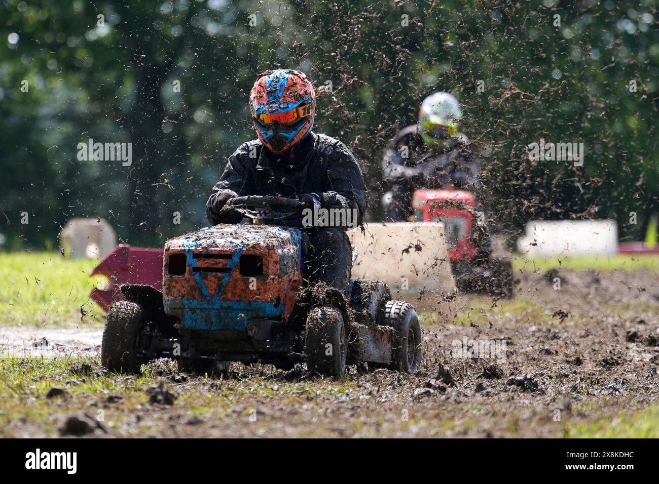 Competitors race in a heat during the World Lawnmower Championships ...