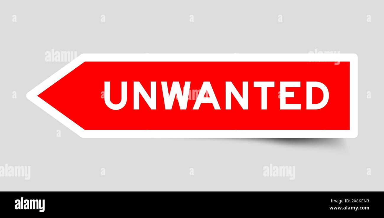 Red color arrow shape sticker label with word unwanted on gray ...