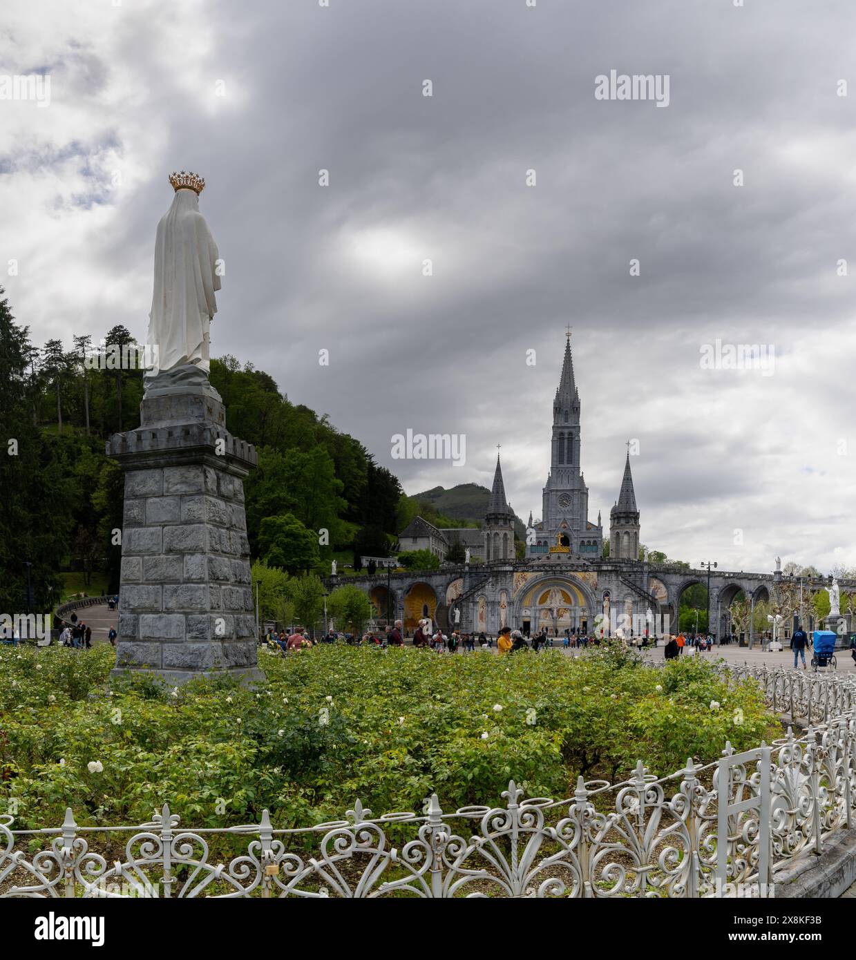 Lourdes, France - 17 April, 2024: view of the Our Lady of Lourdes statue in front of the ...