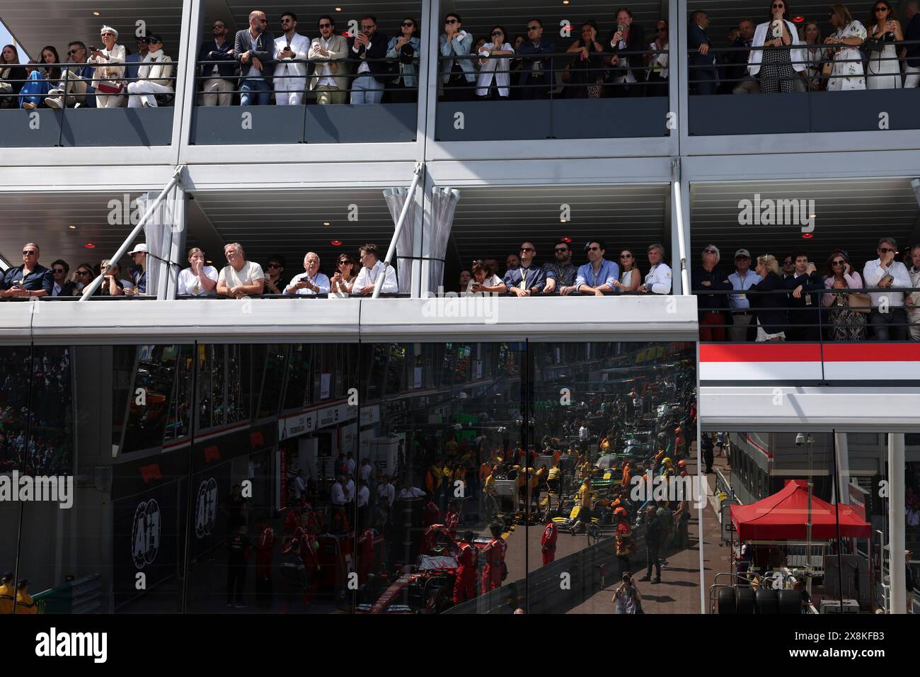 Cars on the pit-lane are reflected during a red flag pause during the ...