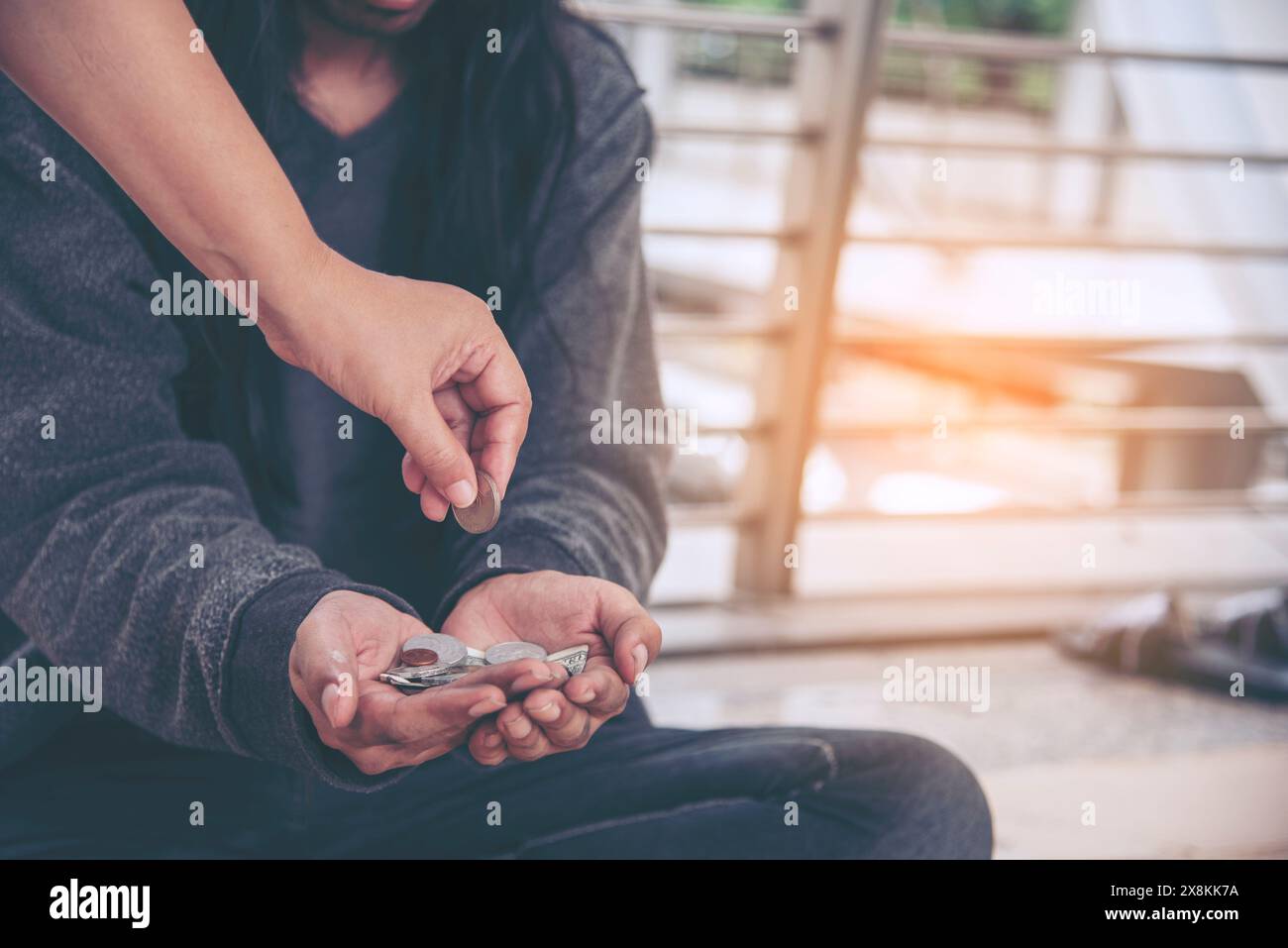 Woman helping hands to homeless people poverty beggar man holding hands ...