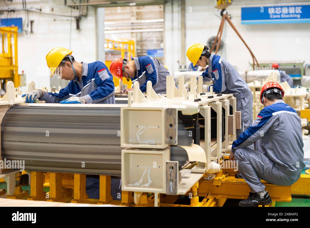 Shanghai. 23rd May, 2024. Staff members work at a factory of CHINT ...