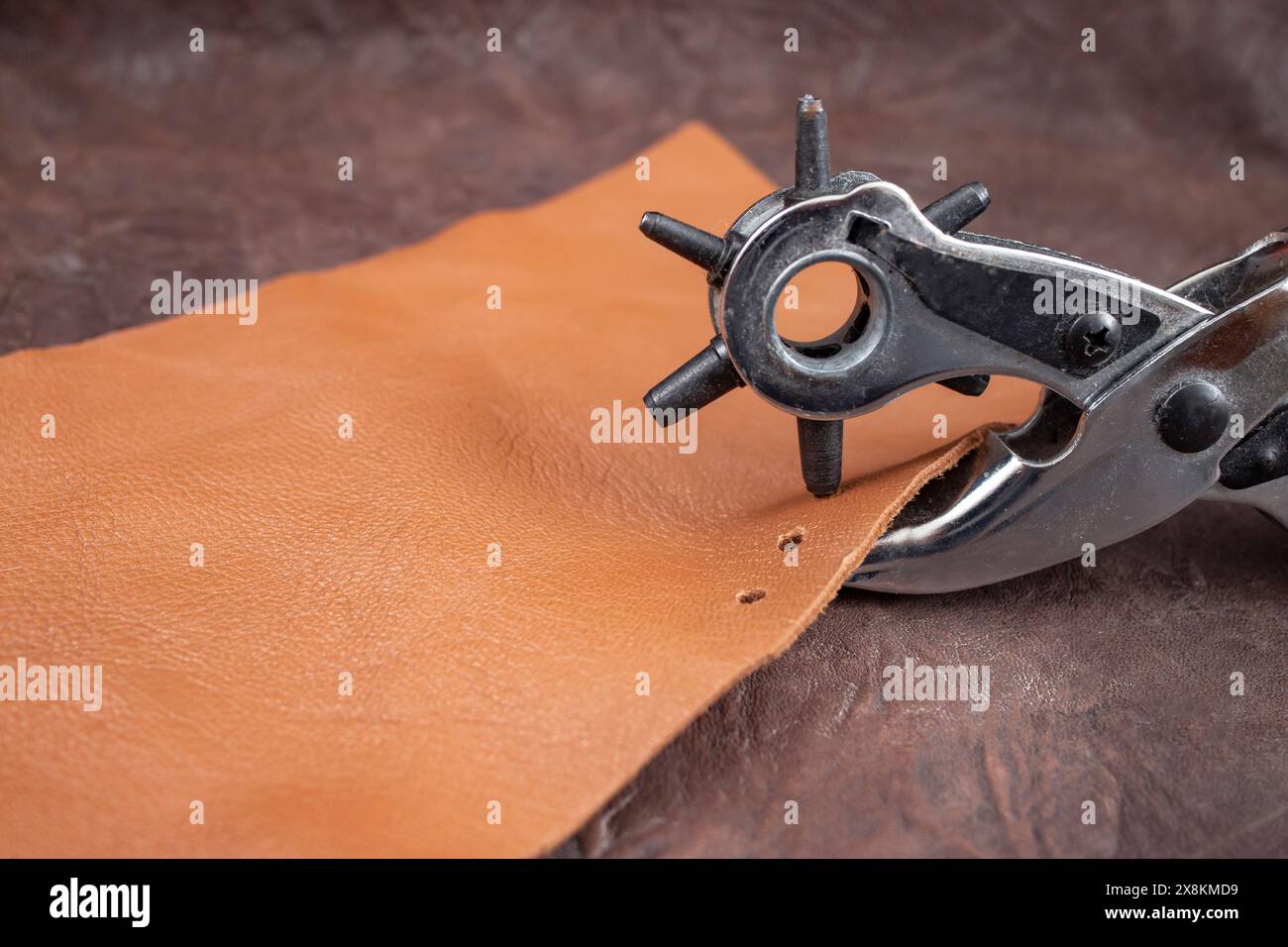 hand instrument used for punching holes in leather, soft focus Stock ...