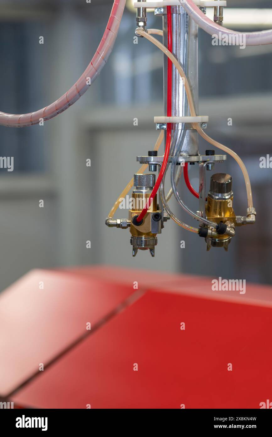 spray head in automatic paint booth Stock Photo - Alamy
