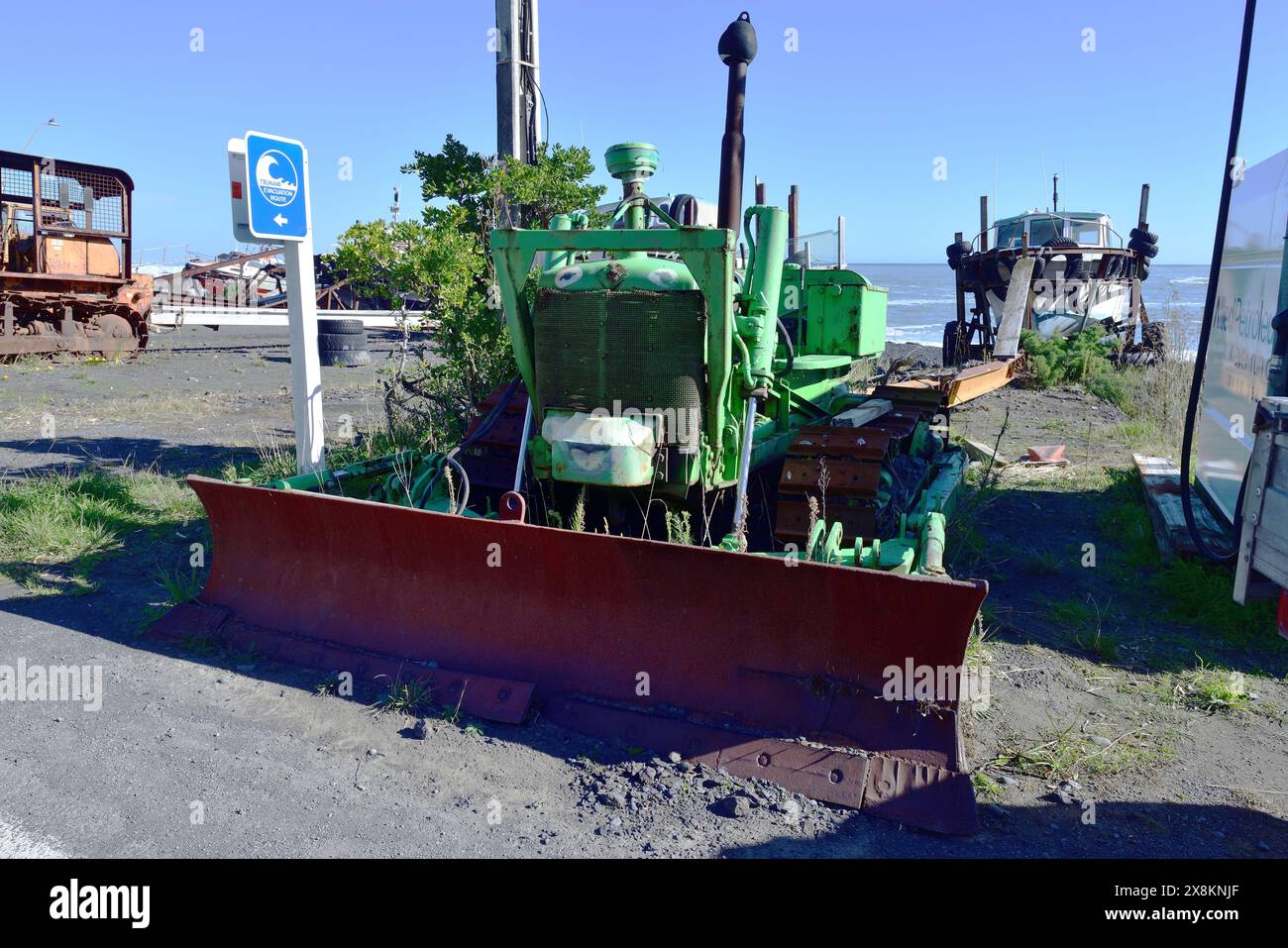 Pirinoa, New Zealand - 05-05-24:Vinatge green excavator tractor and ...