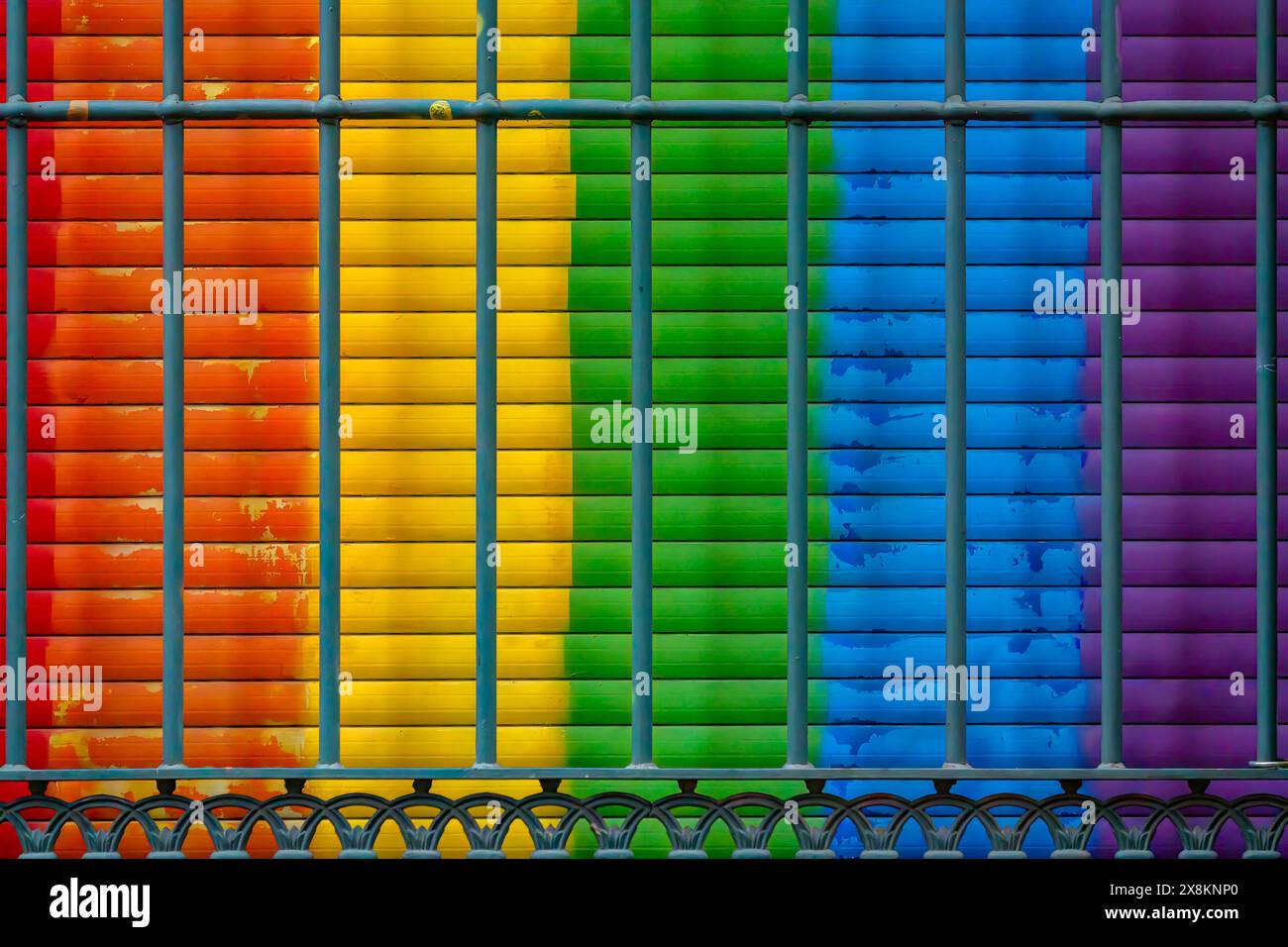 Metal grate in front of the rainbow colored window blinds Stock Photo ...