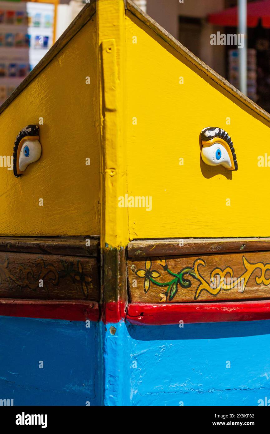 Yellow wooden boat with a Maltese design on the street Stock Photo - Alamy