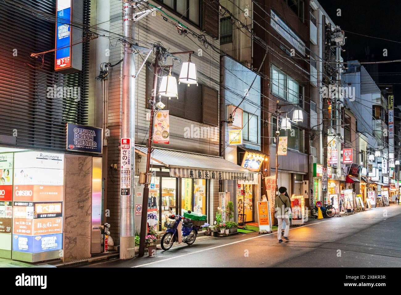 Evening view along street packed with restaurants, diners and clubs in ...